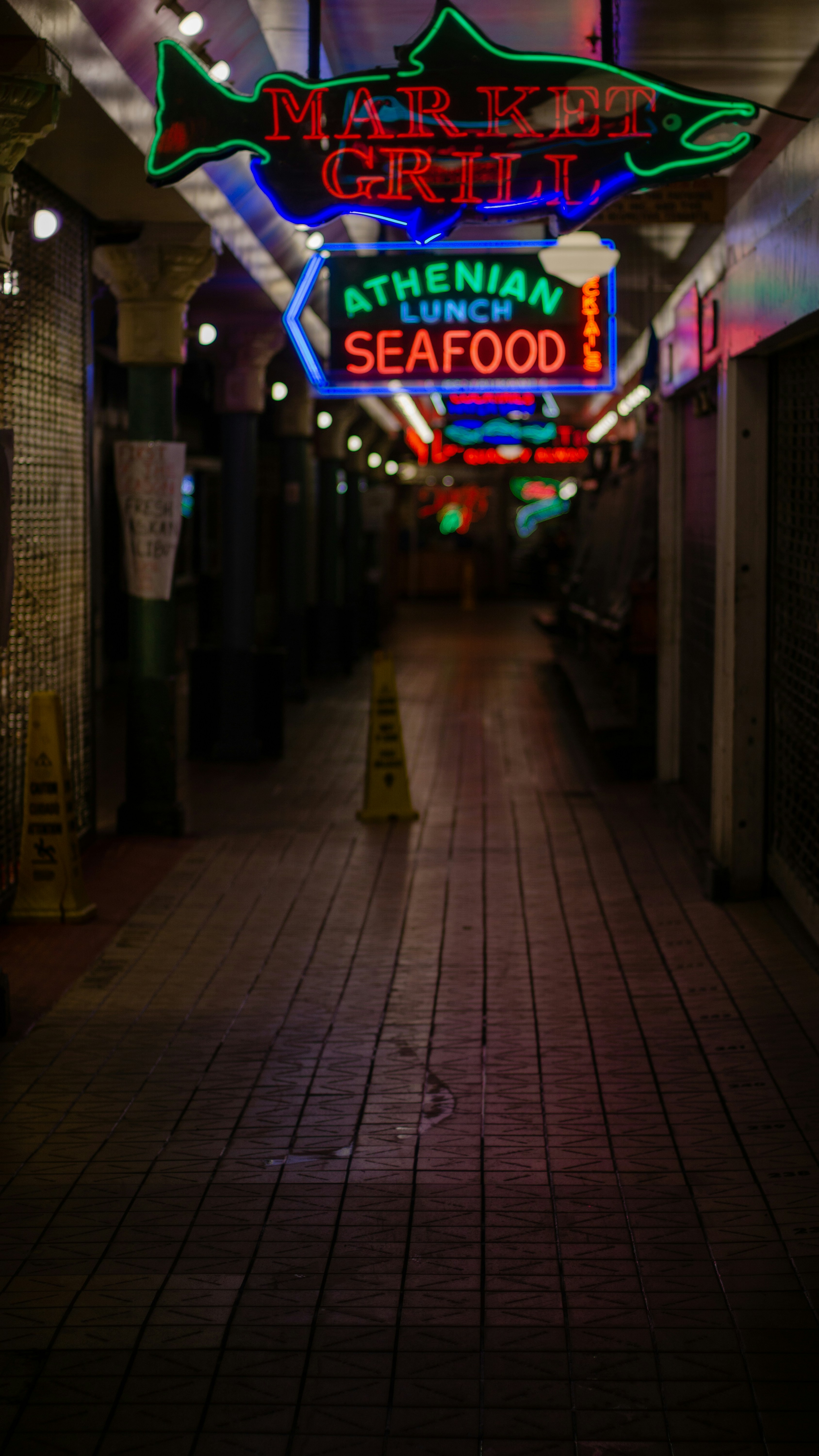 a neon sign that is on the side of a building