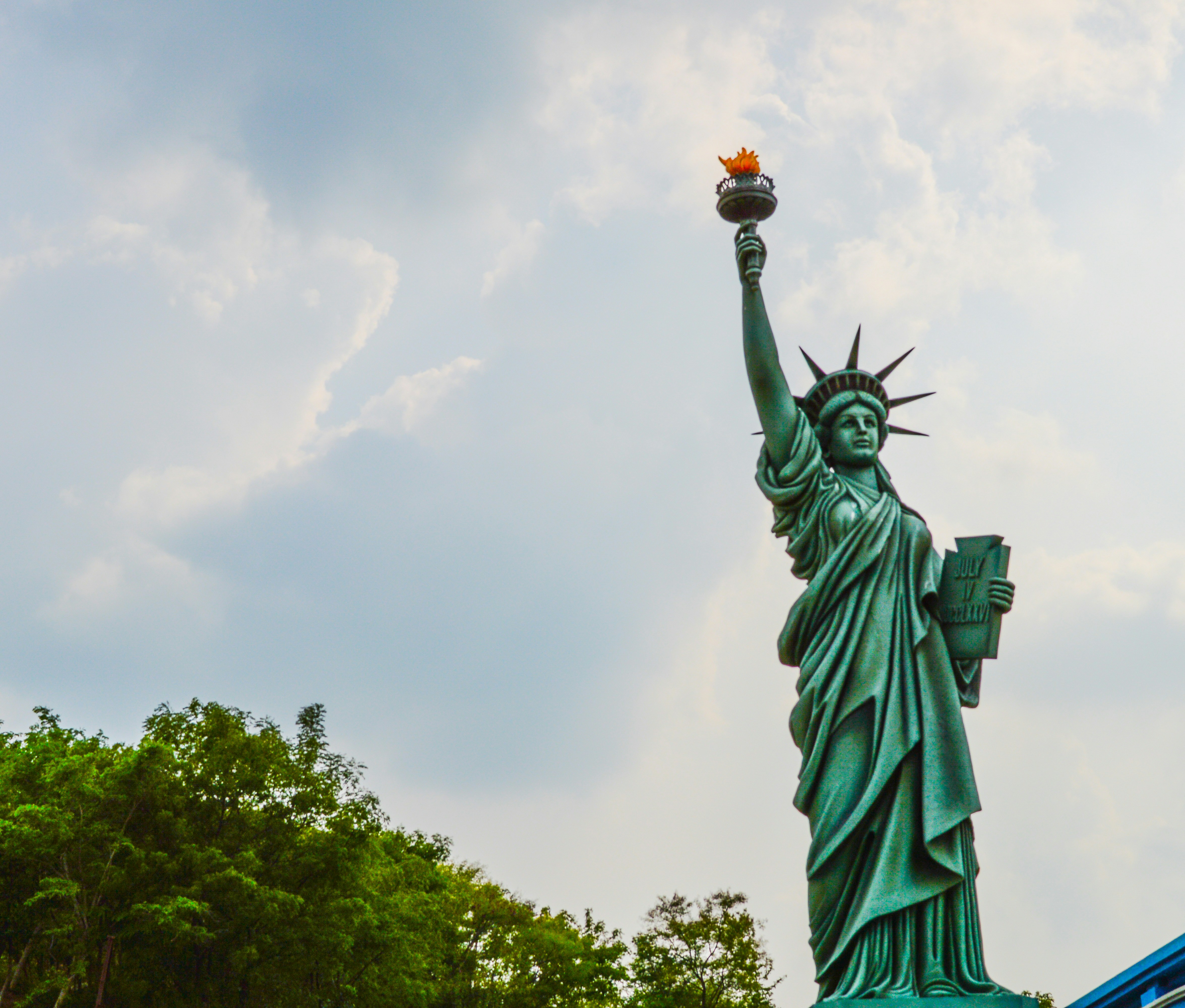 Torch in Hand, Liberty in Bronze: The Statue of Freedom Reaches Toward the Sky