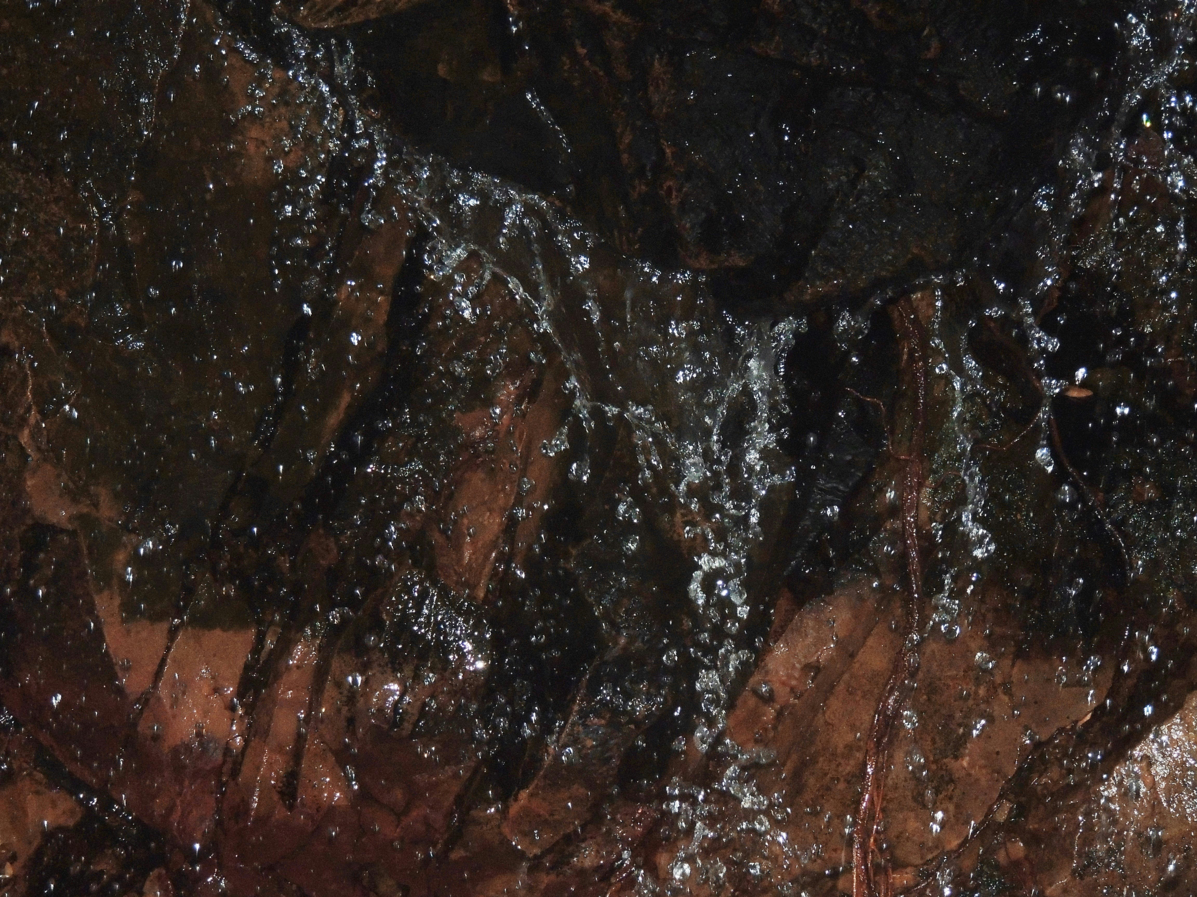 A close up of water running over rocks photo – Free Tada waterfalls ...