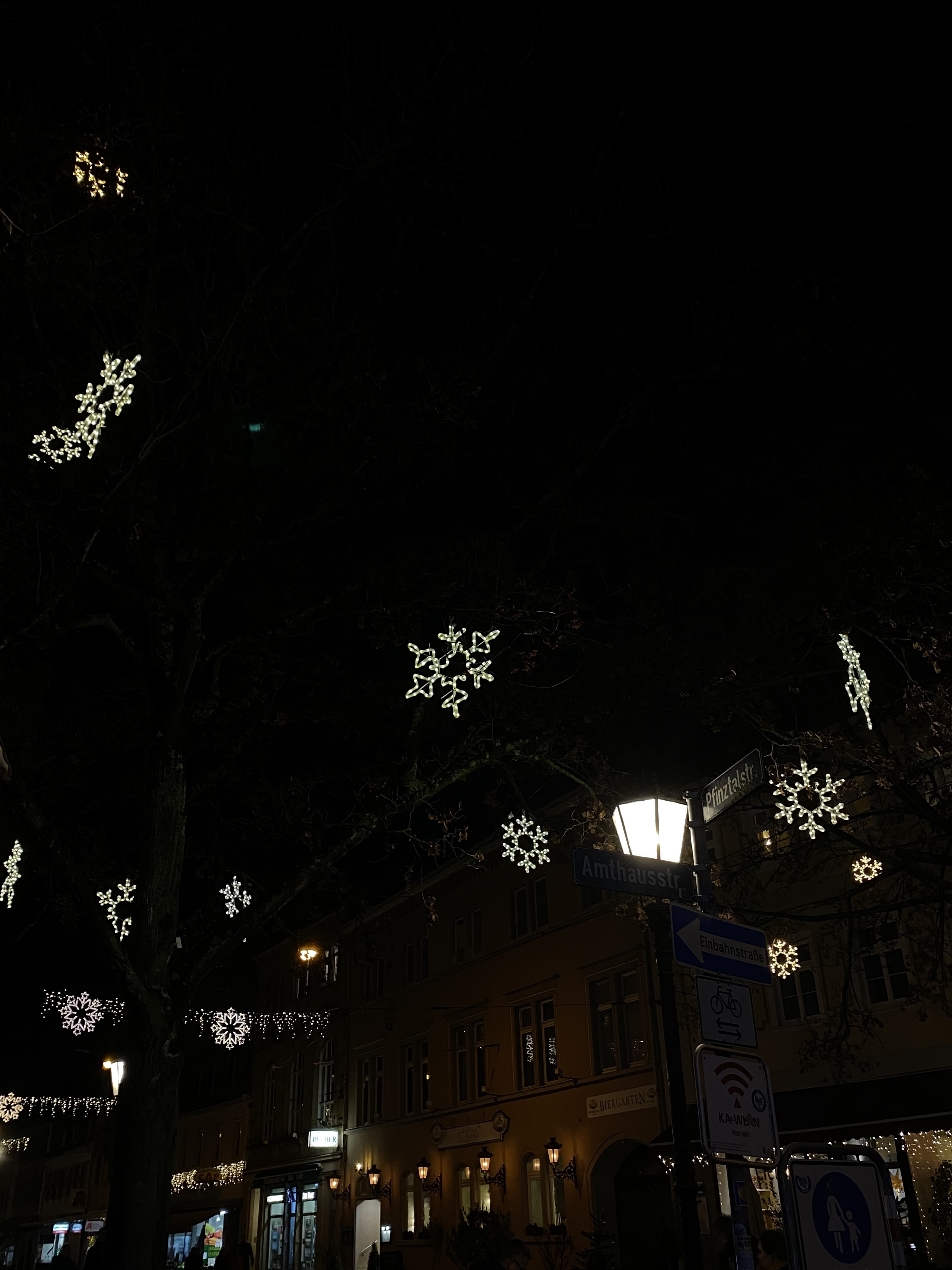 Snowflake Illumination Over a Quiet Night Street