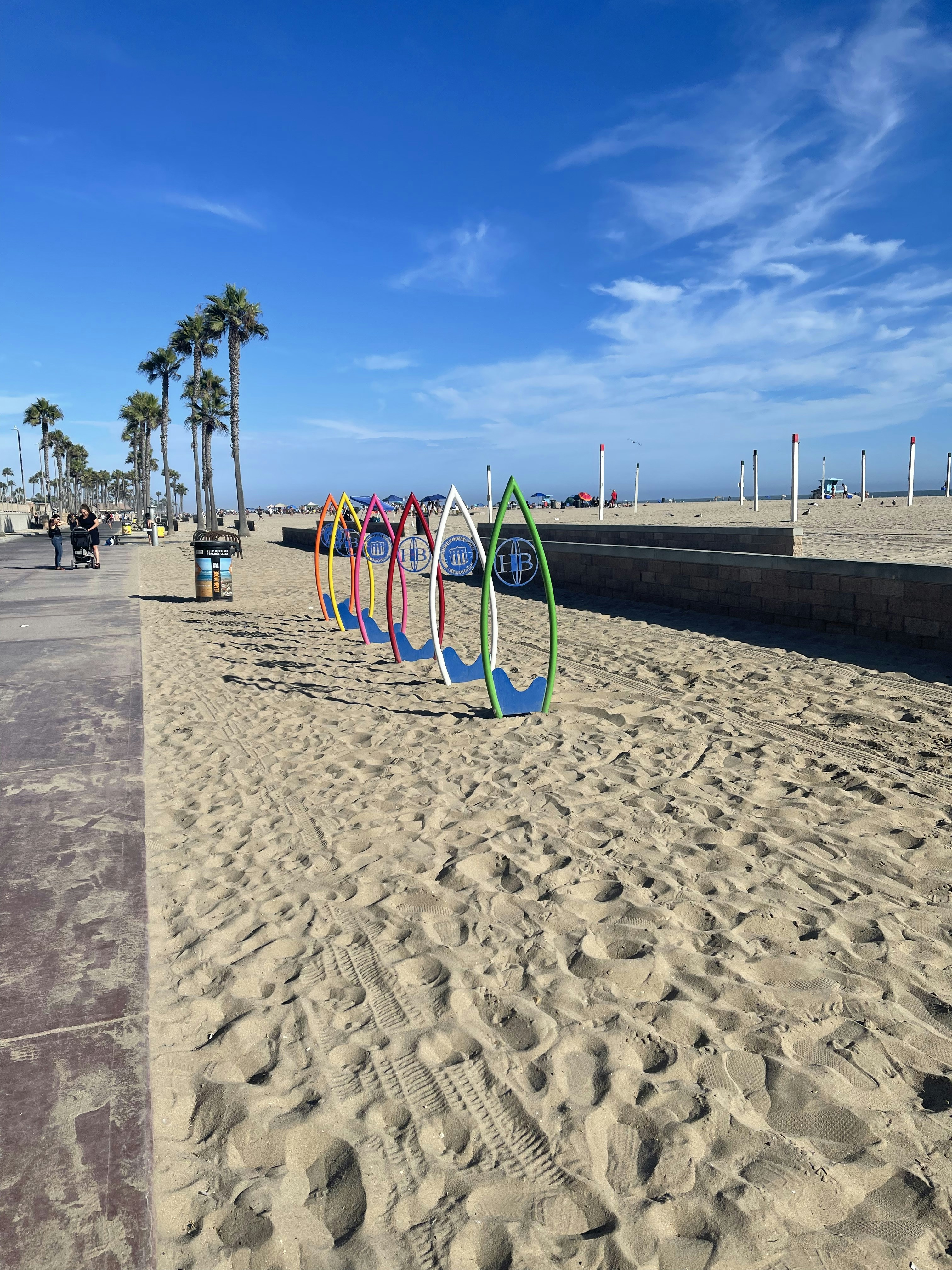 A row of surfboards sitting on top of a sandy beach photo – Free ...