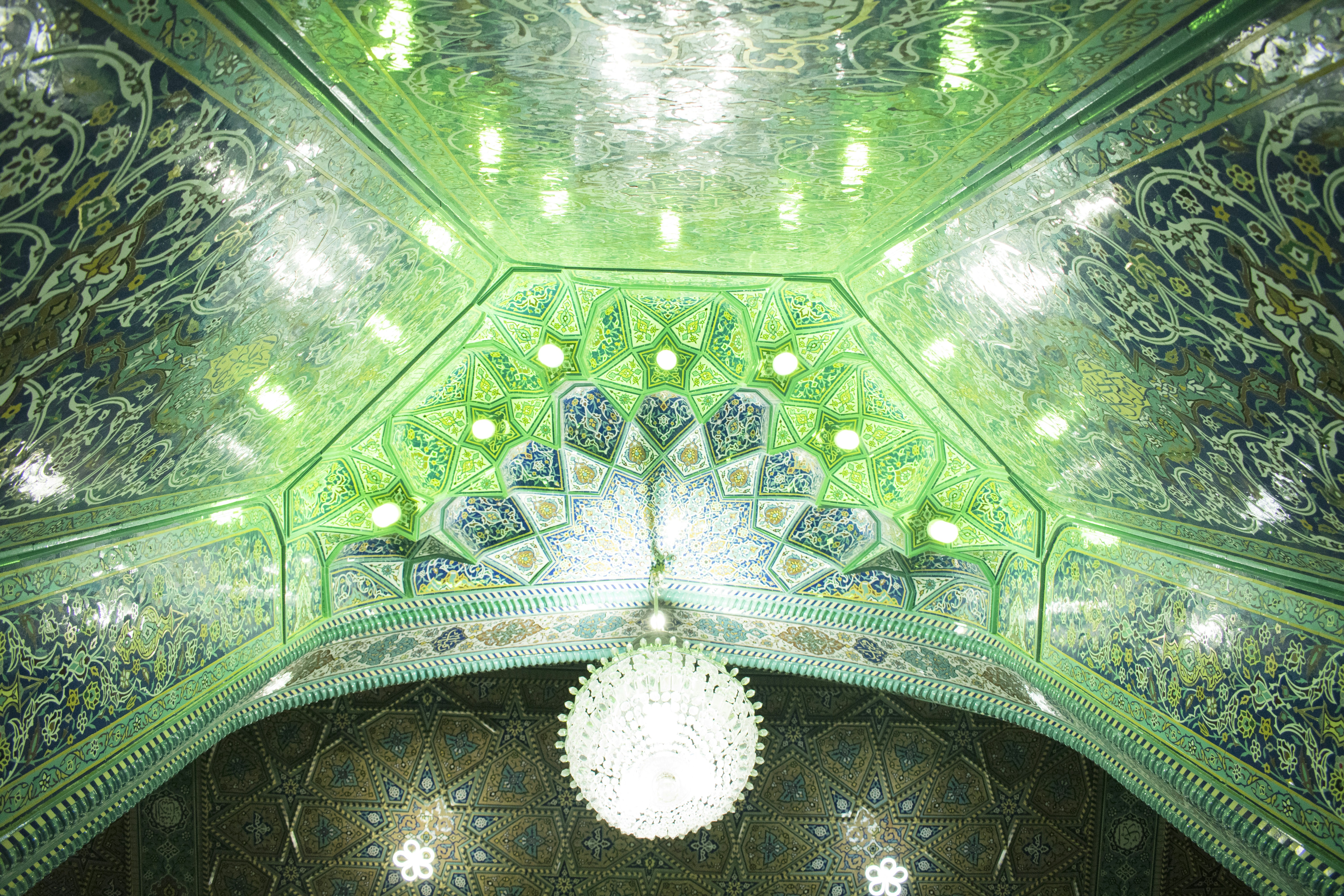 Verdant Vault: Neon-green Illumination on an Islamic Ceiling