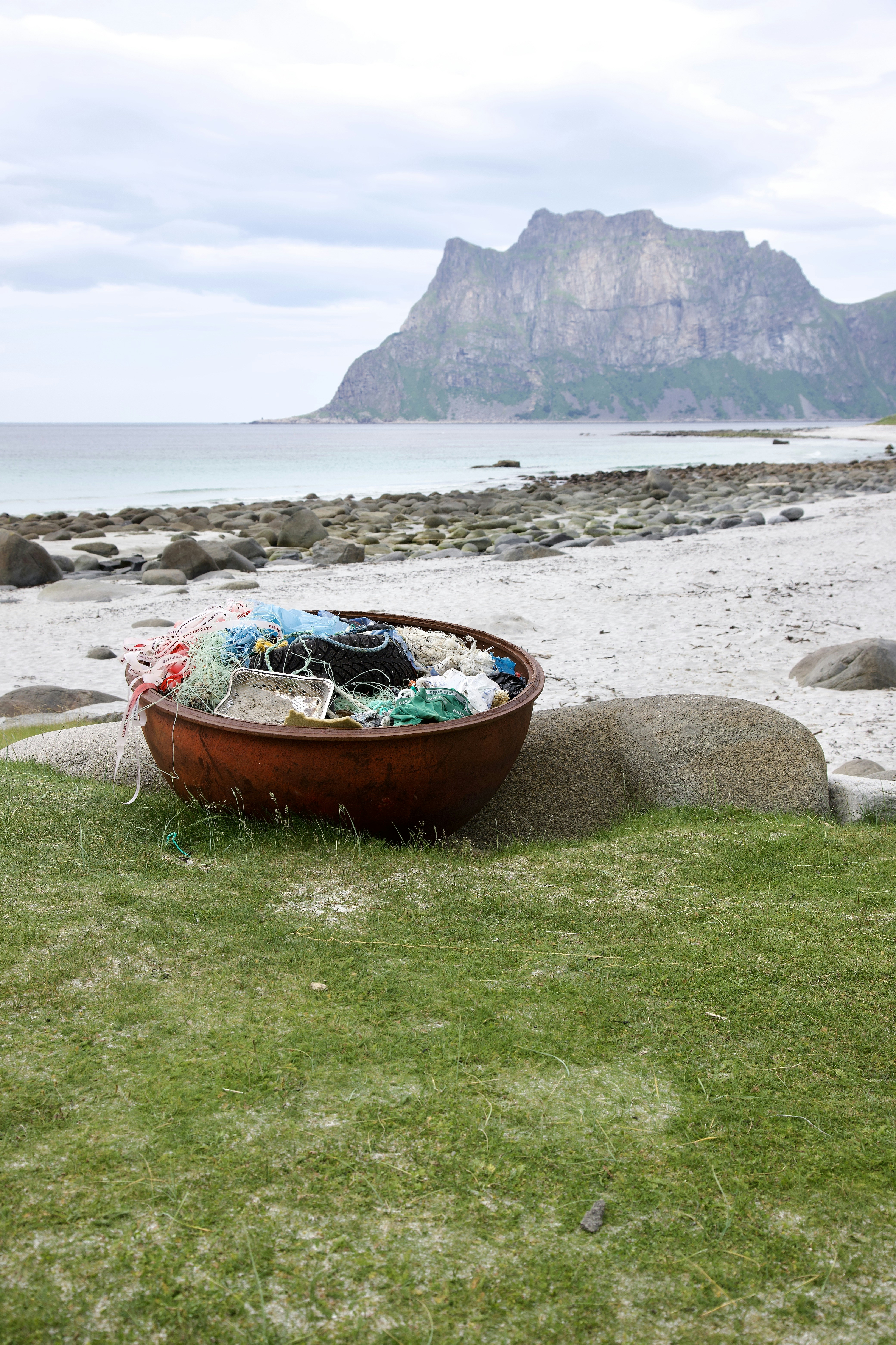 Rusty Net Basin on a Quiet Shore with a Rugged Island Rising Beyond
