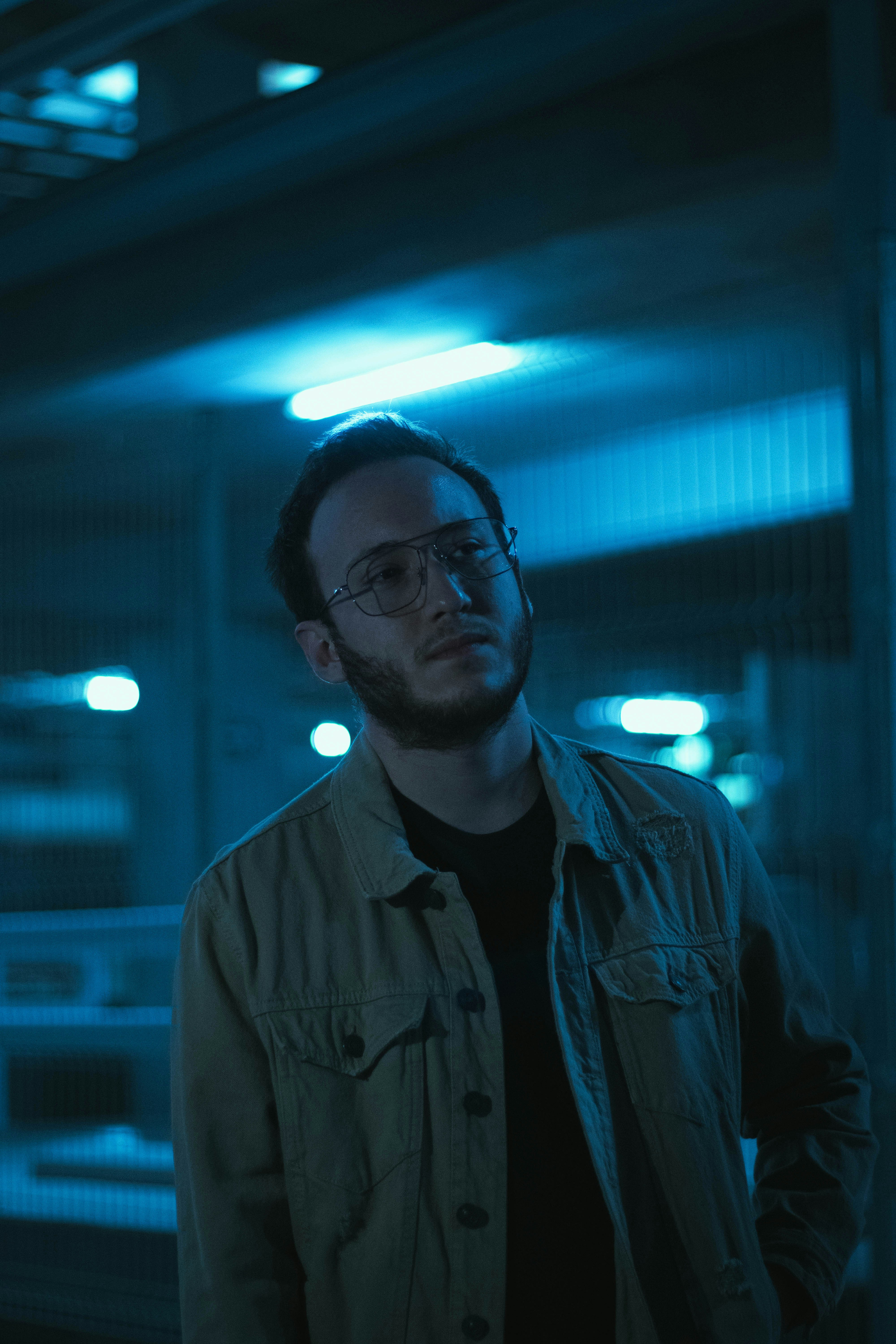 Blue Neon Memorandum: A Contemplative Portrait in an Industrial Chill