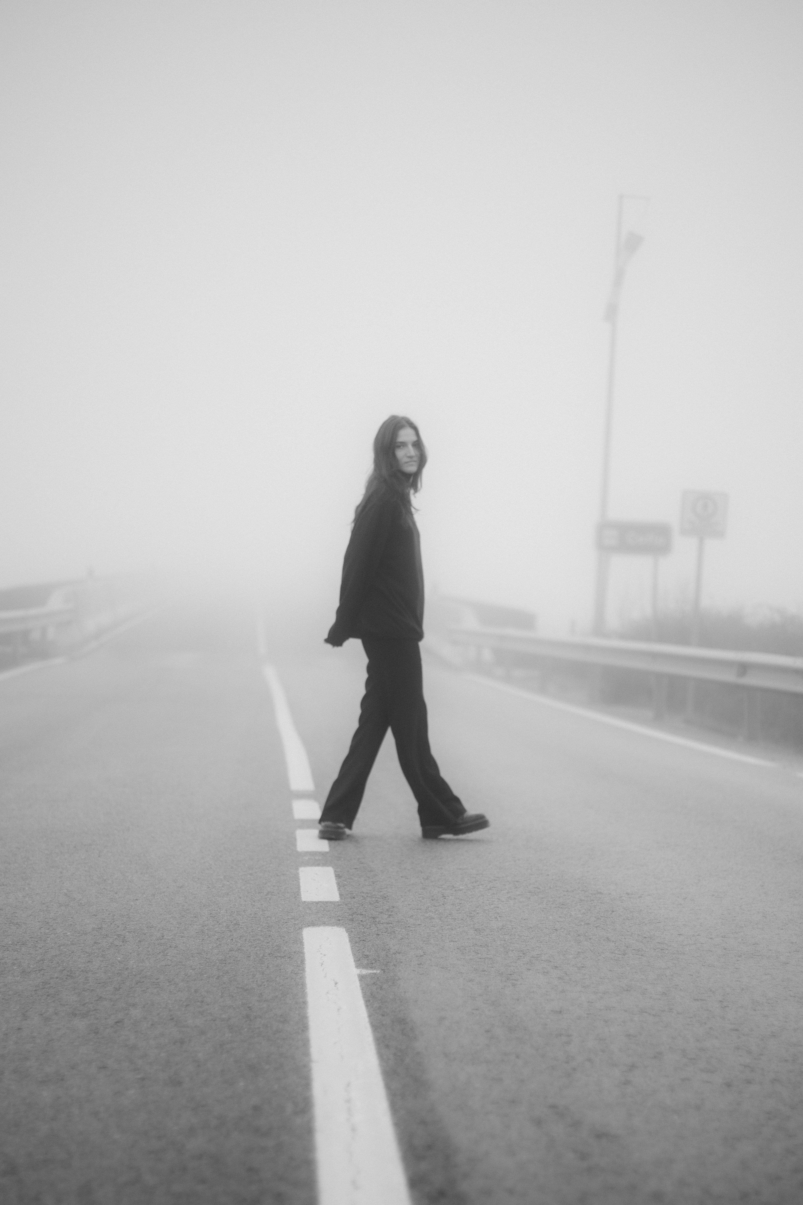 Walking Into Silence on a Fogged Highway