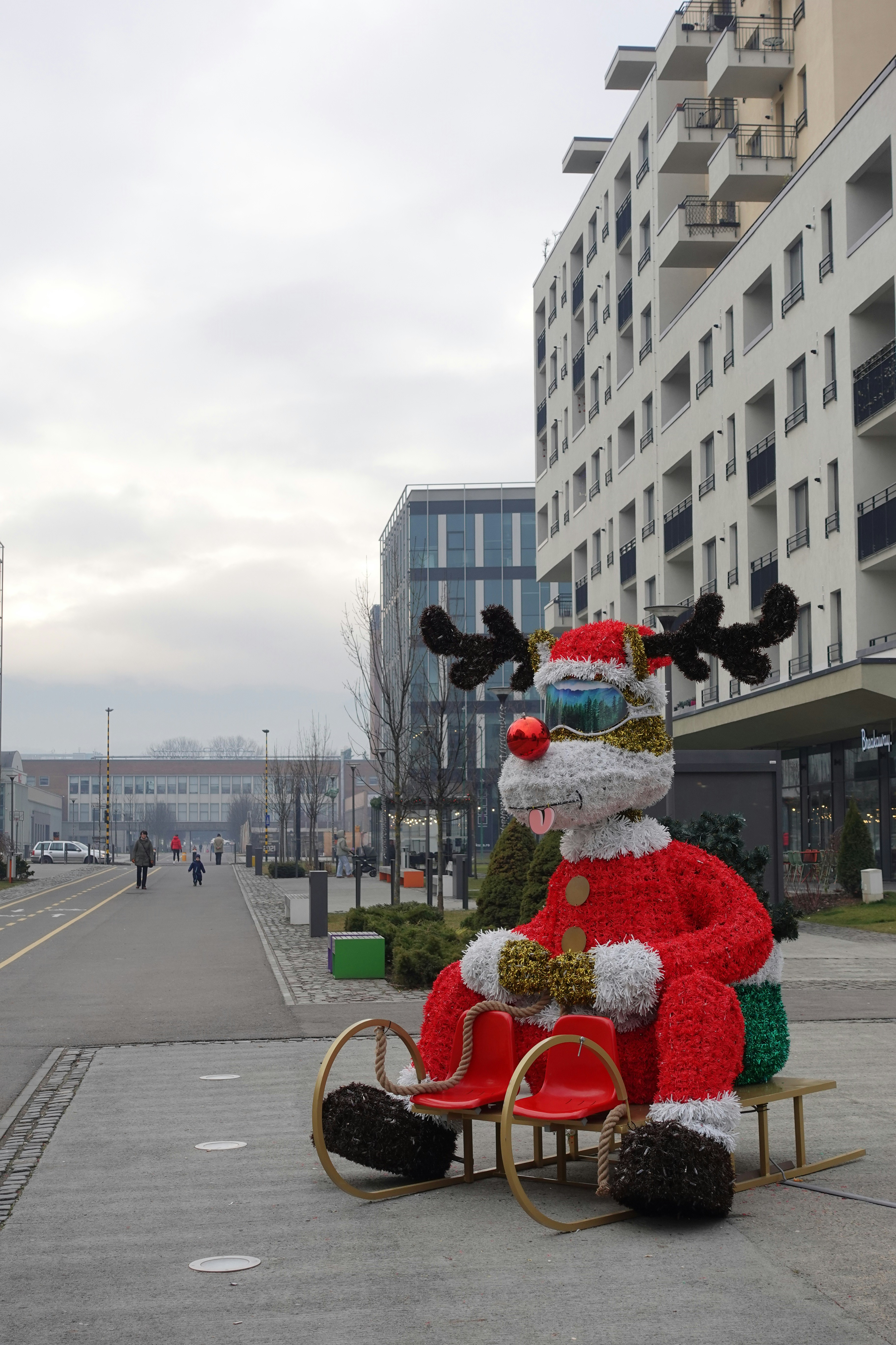 A christmas decoration of a santa clause sitting on a sleigh photo ...