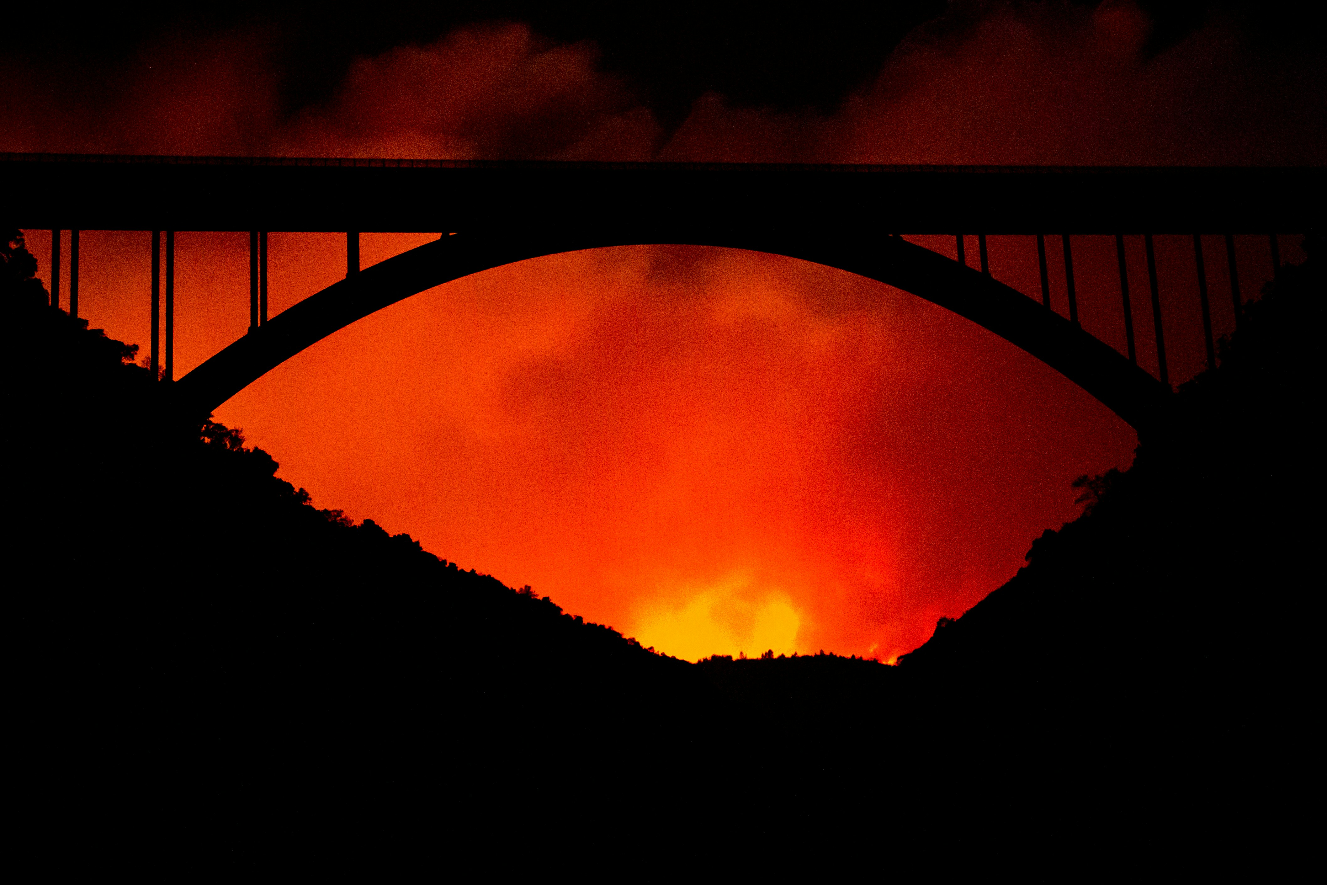 Ember Arch: Silhouette Under a Fiery Sunset