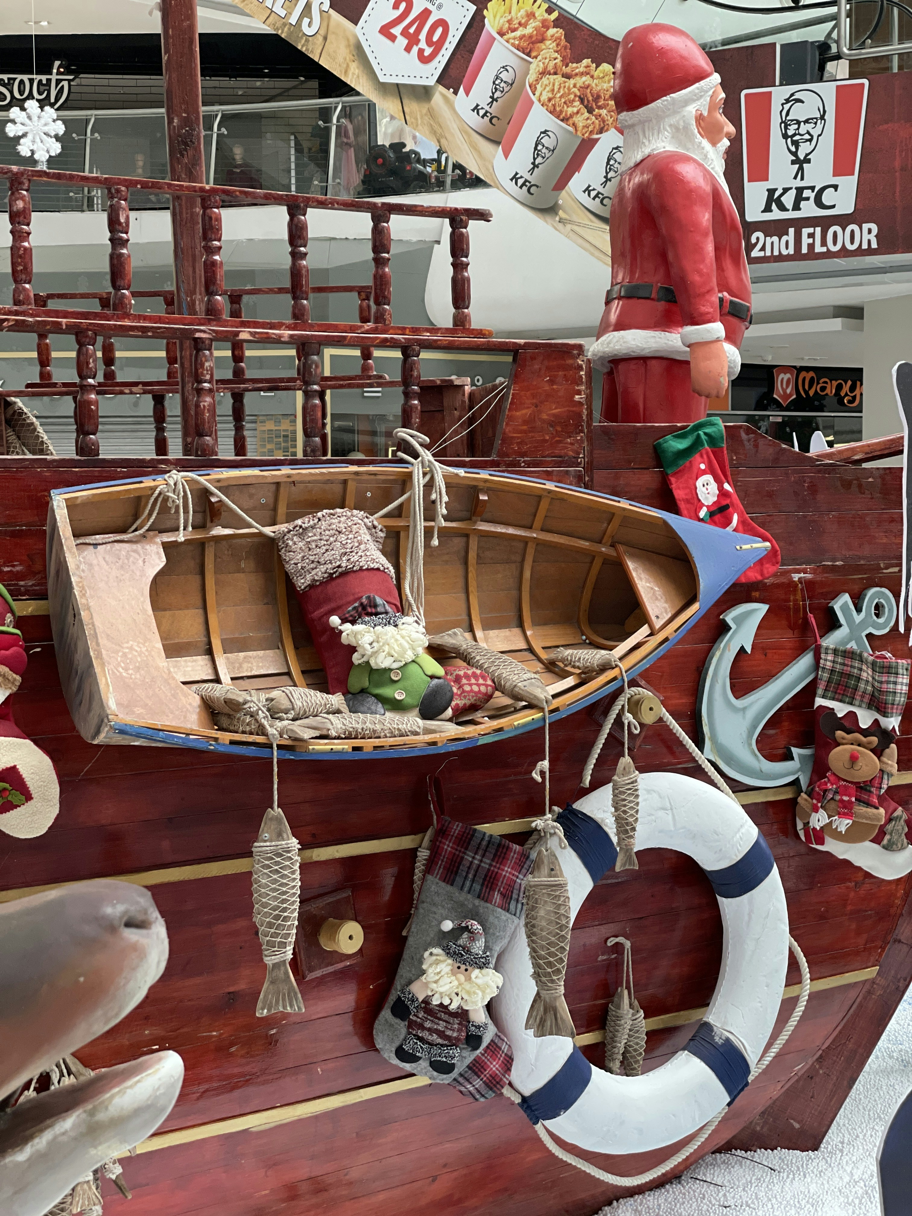 Festive dockside vignette: Santa sails with nautical ornaments