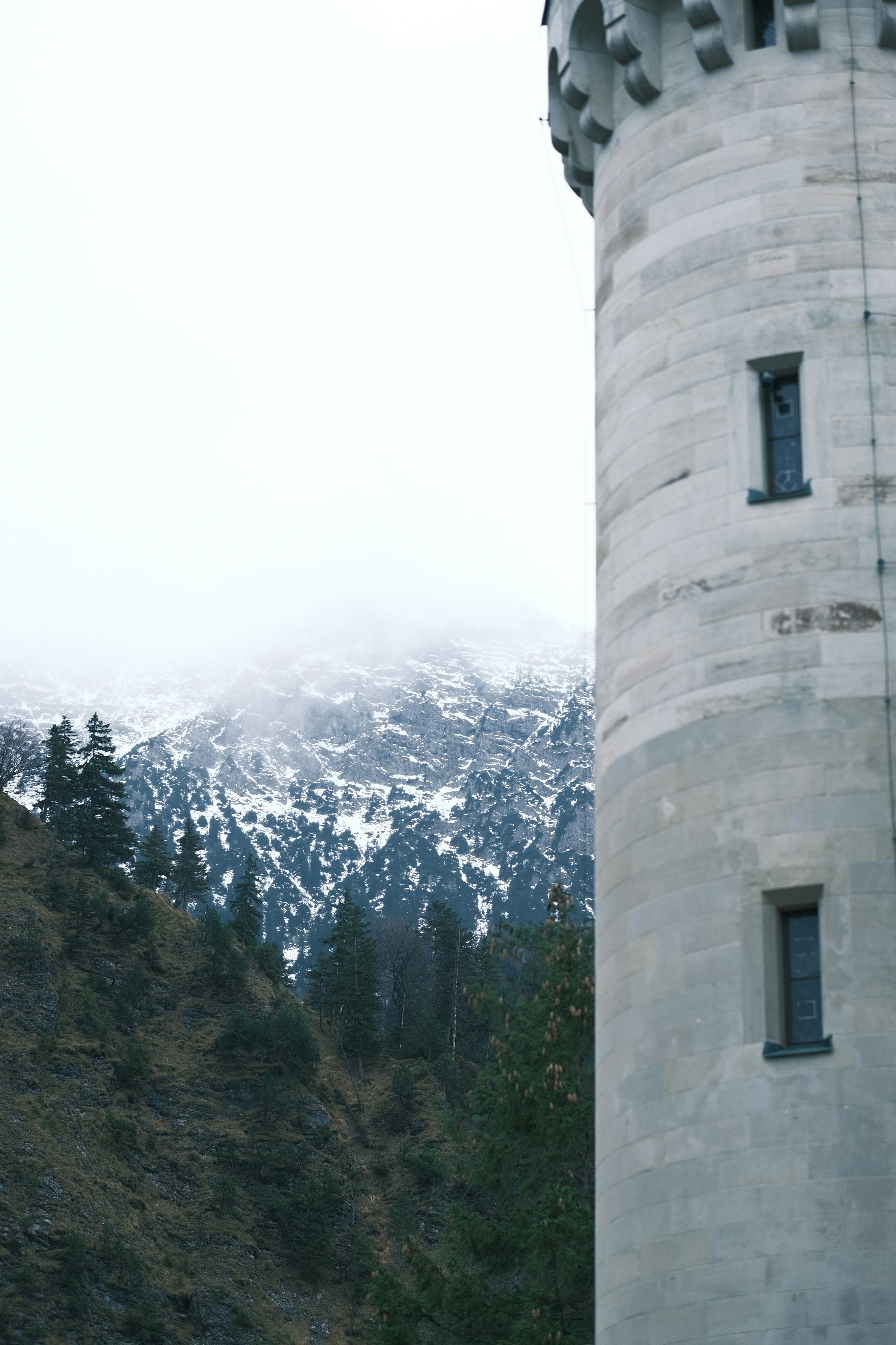 a tall tower with a clock on the top of it