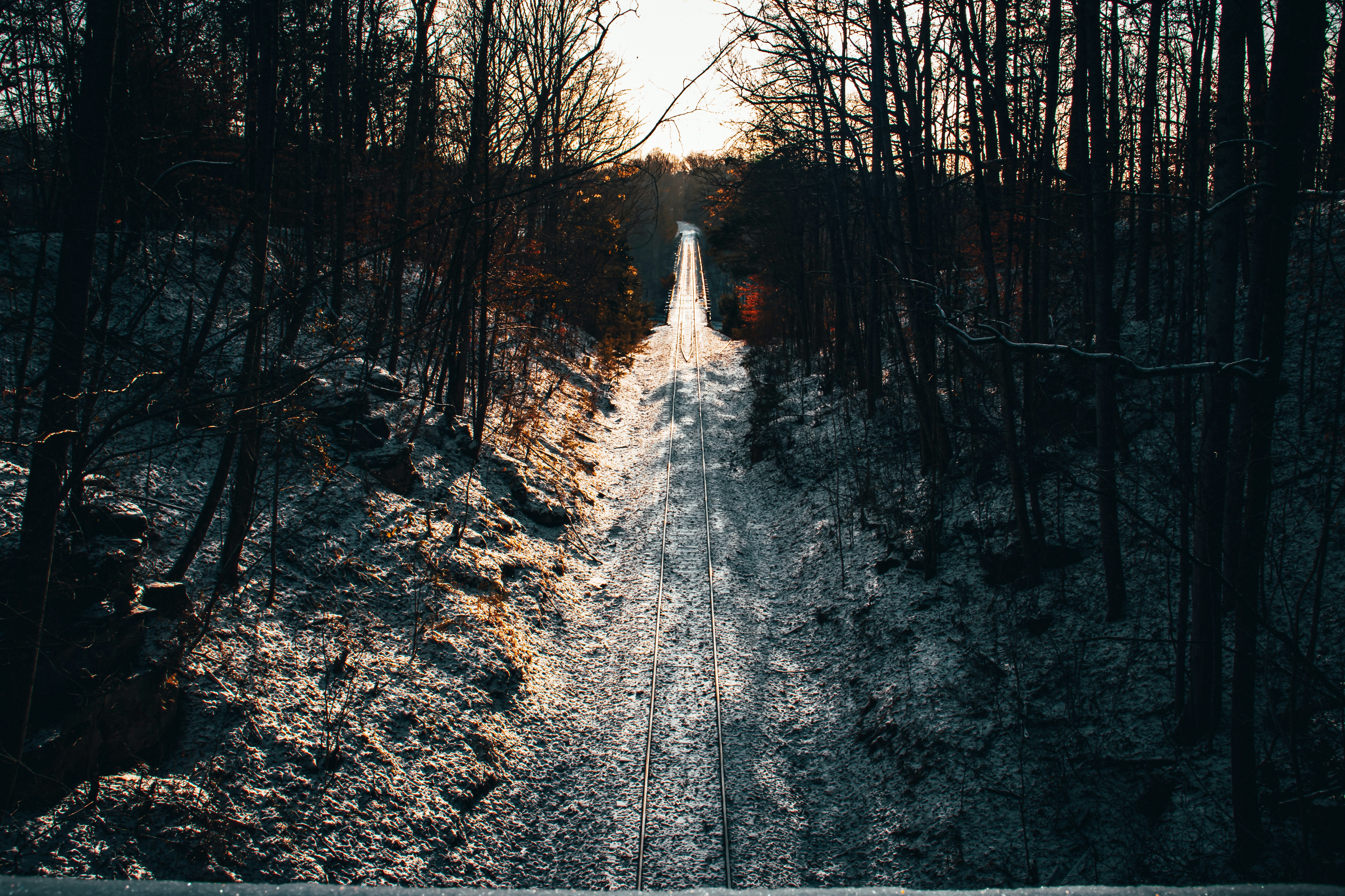 Winter railway valley: light at the far end of the tracks