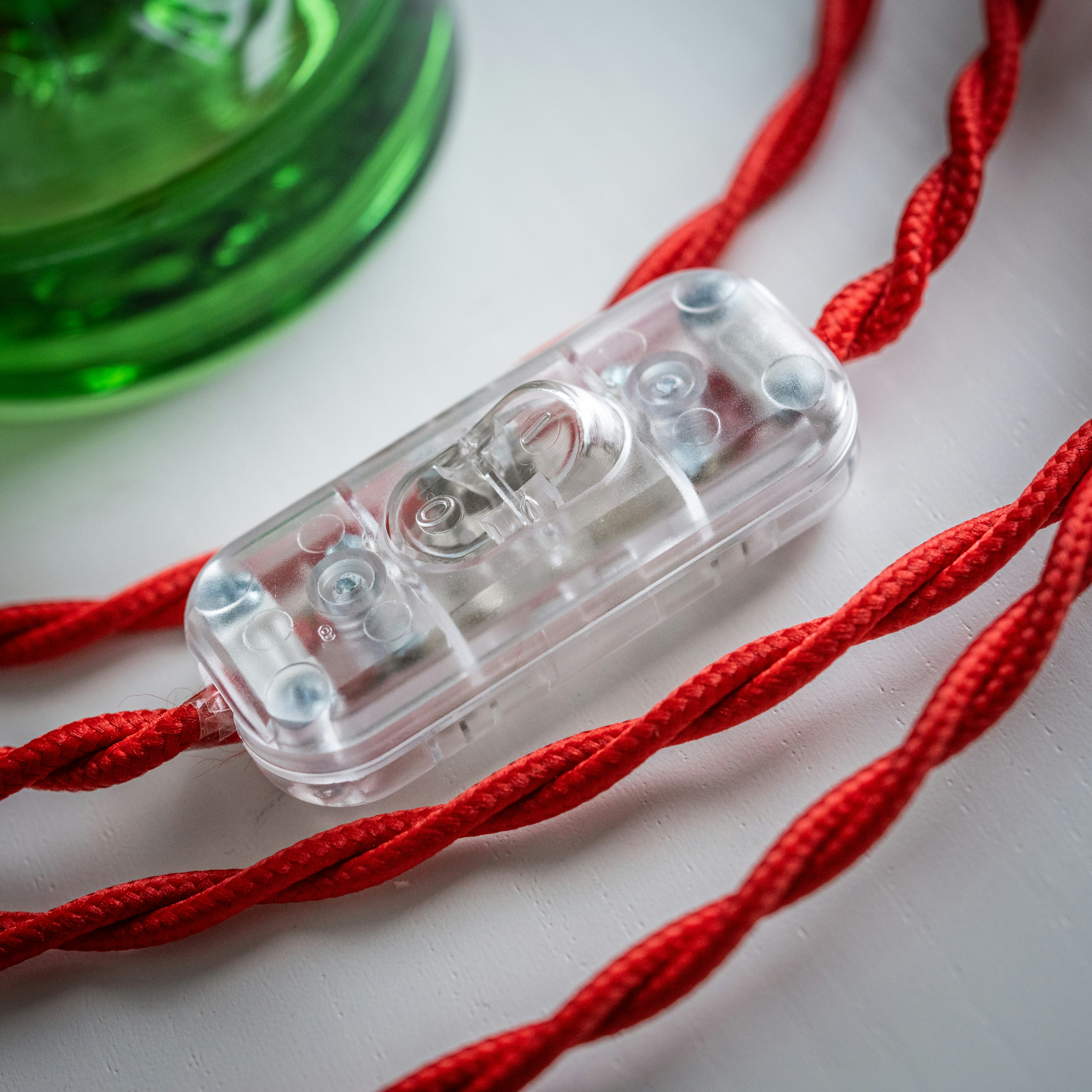 A pair of white ear buds sitting on top of a red string photo – Free # ...