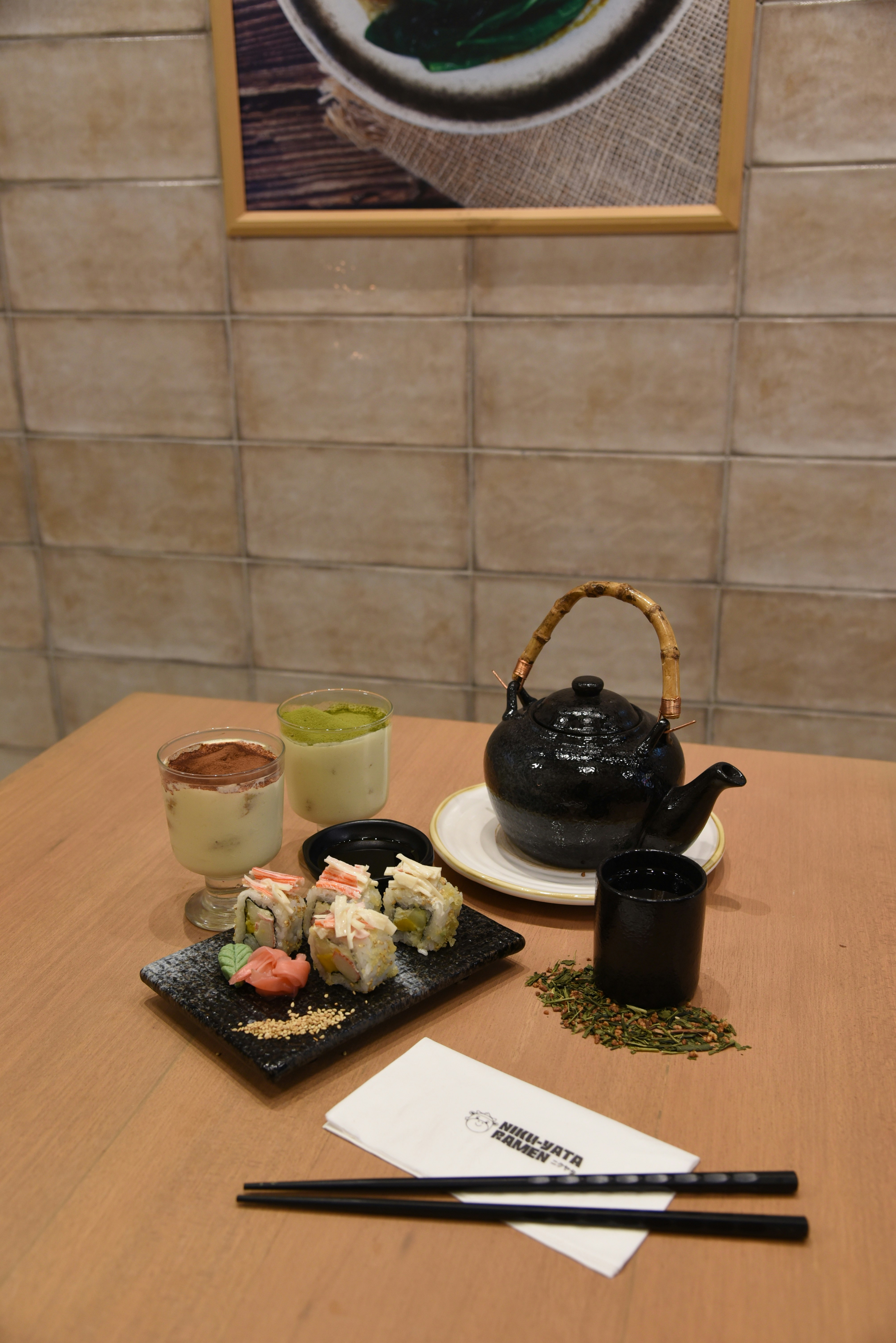 Bamboo-Handled Teapot Frames Sushi: A Quiet Tabletop Moment