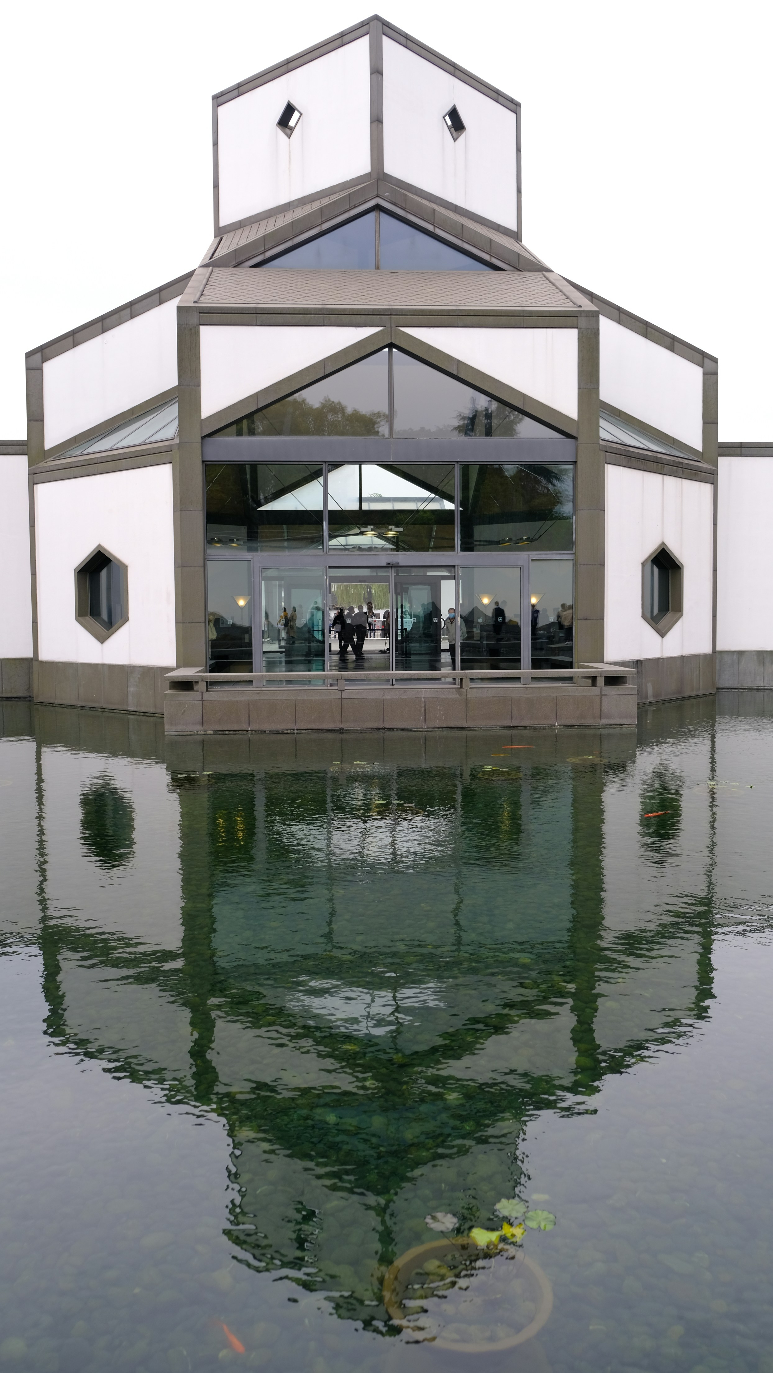 a building with a large body of water in front of it