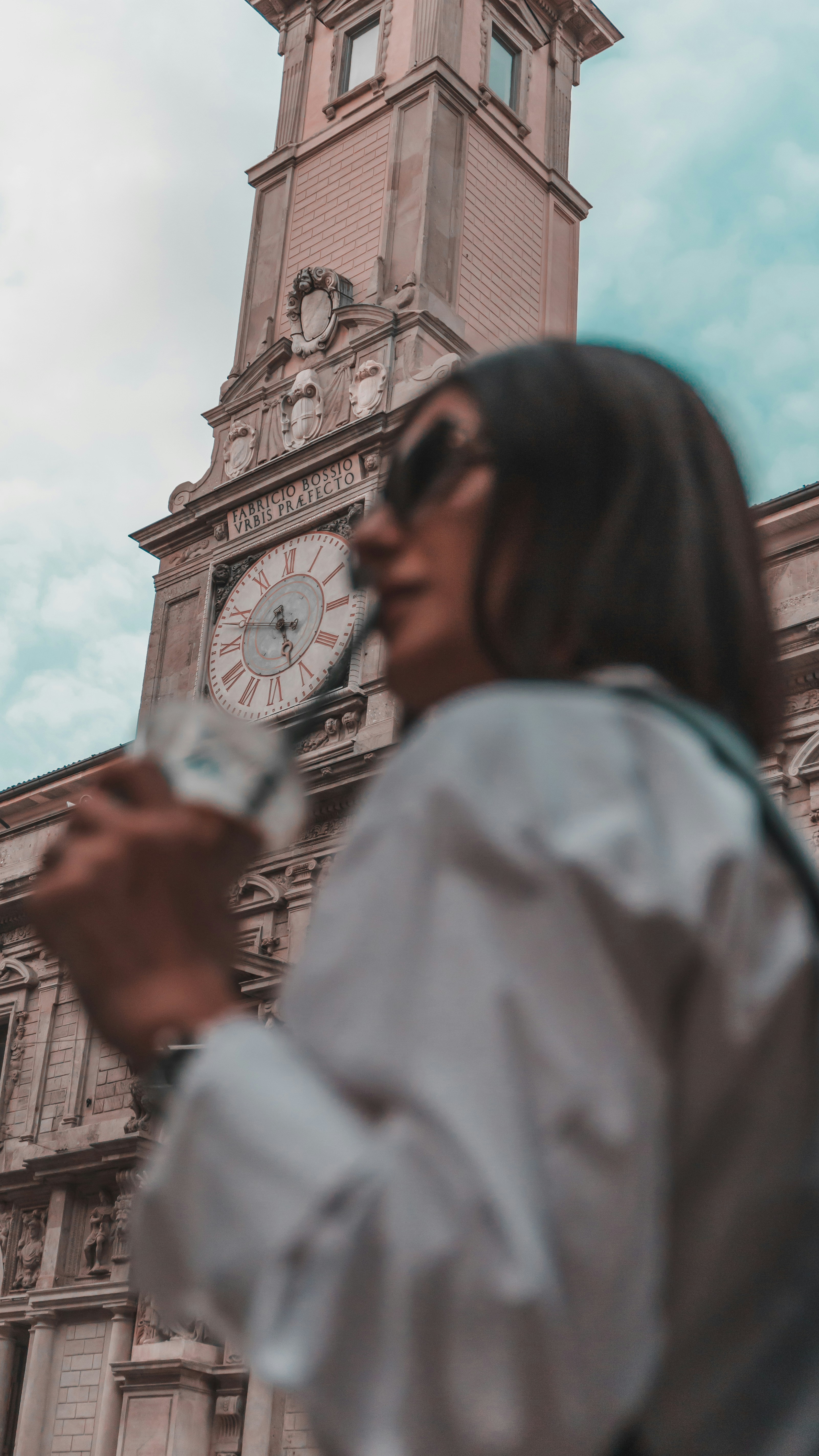 Clocktower in Focus: A Blurred Moment with a City Tale