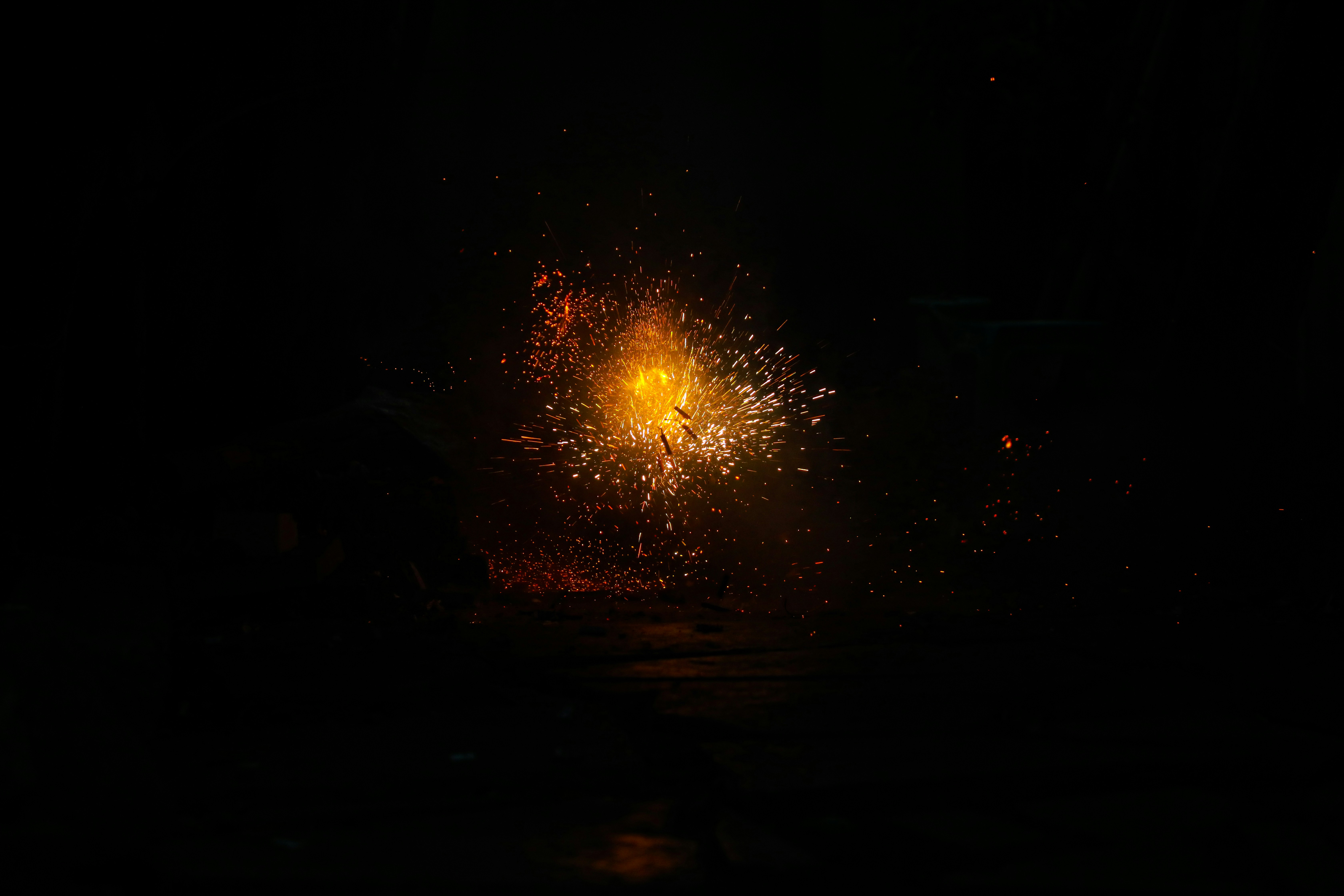a firework is lit up in the night sky