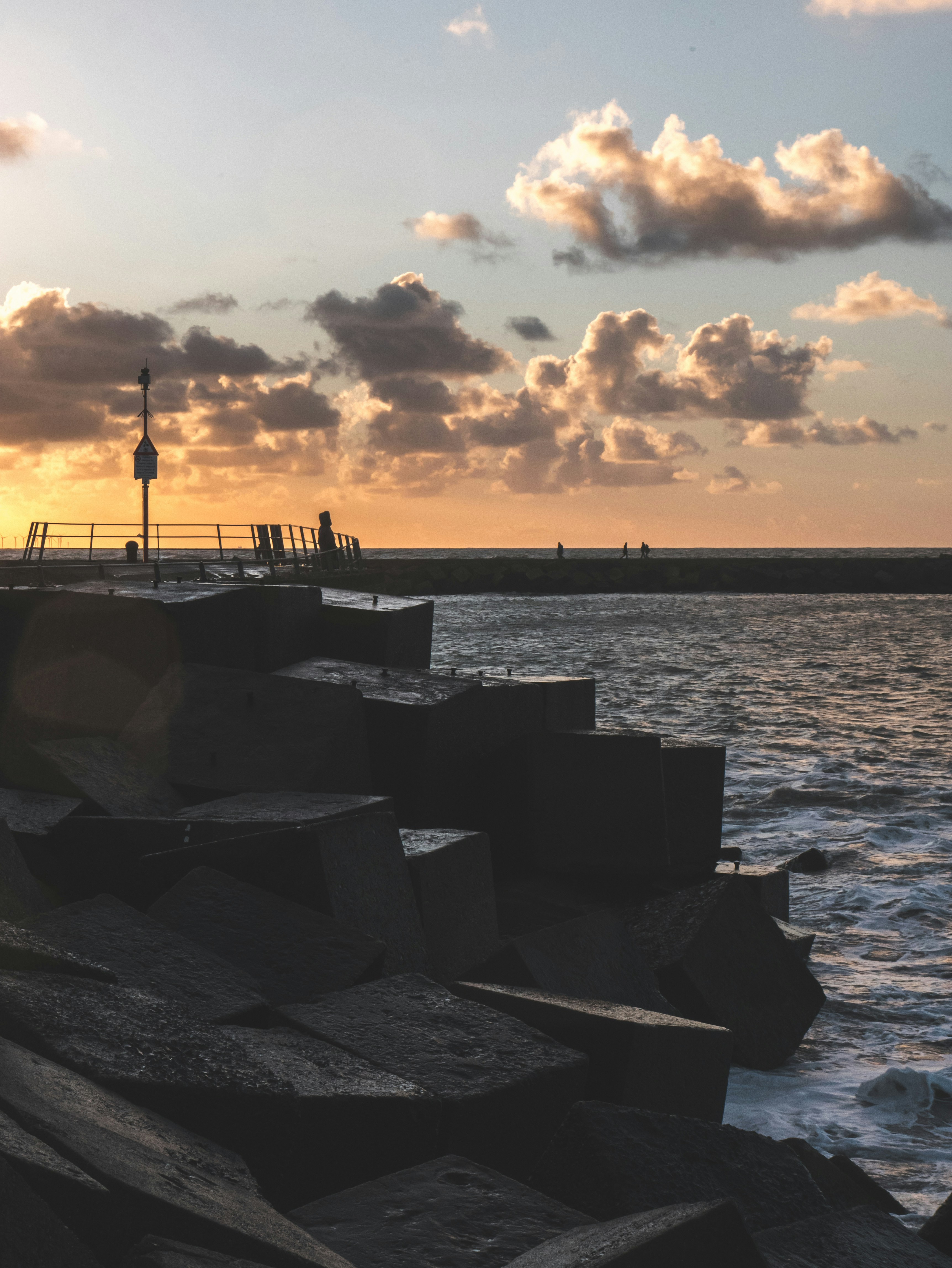 Dramatic sunset on the pier in The Hague beach, Netherlands