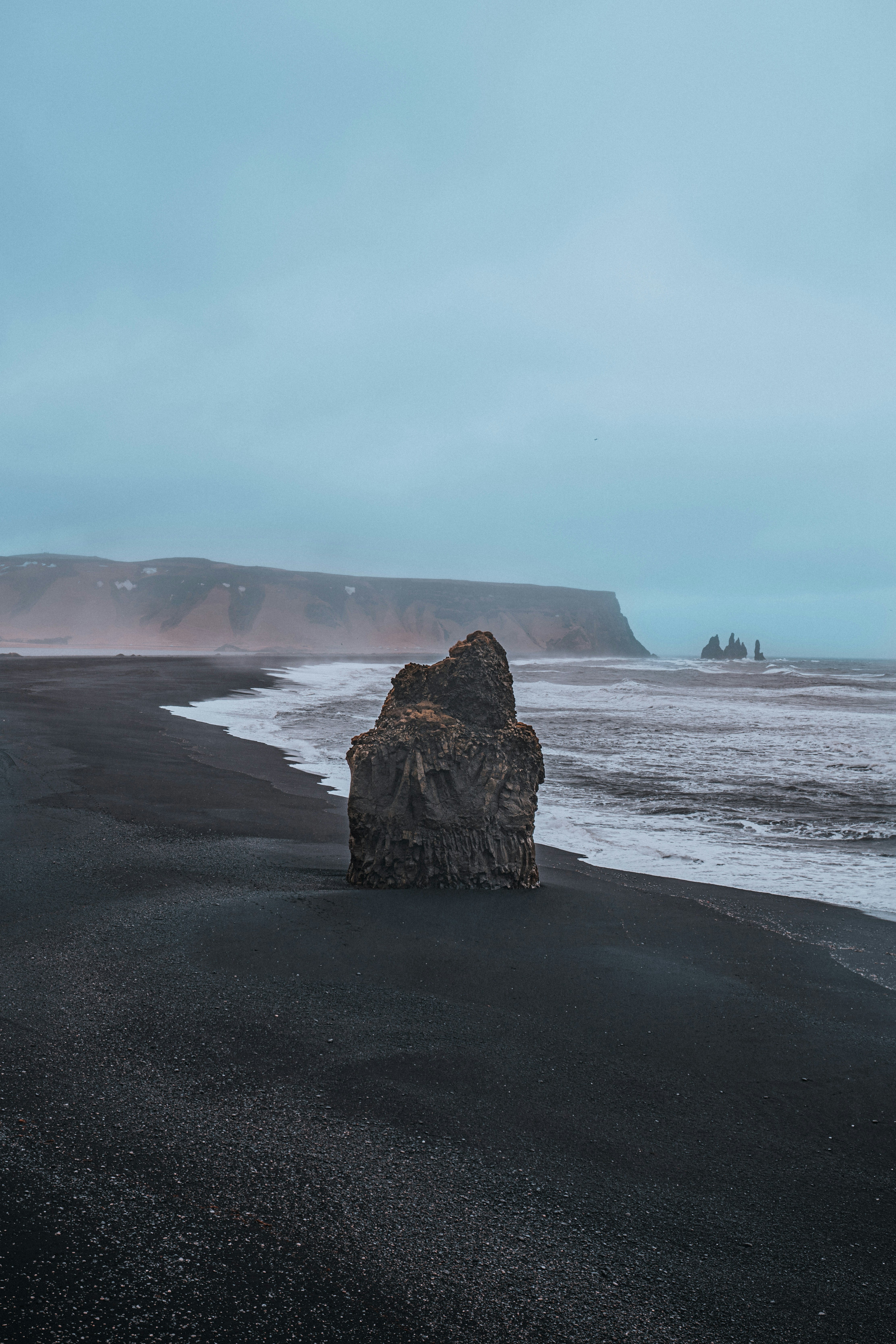 Lone Basalt Sentinel on Iceland's Black Sand Coast