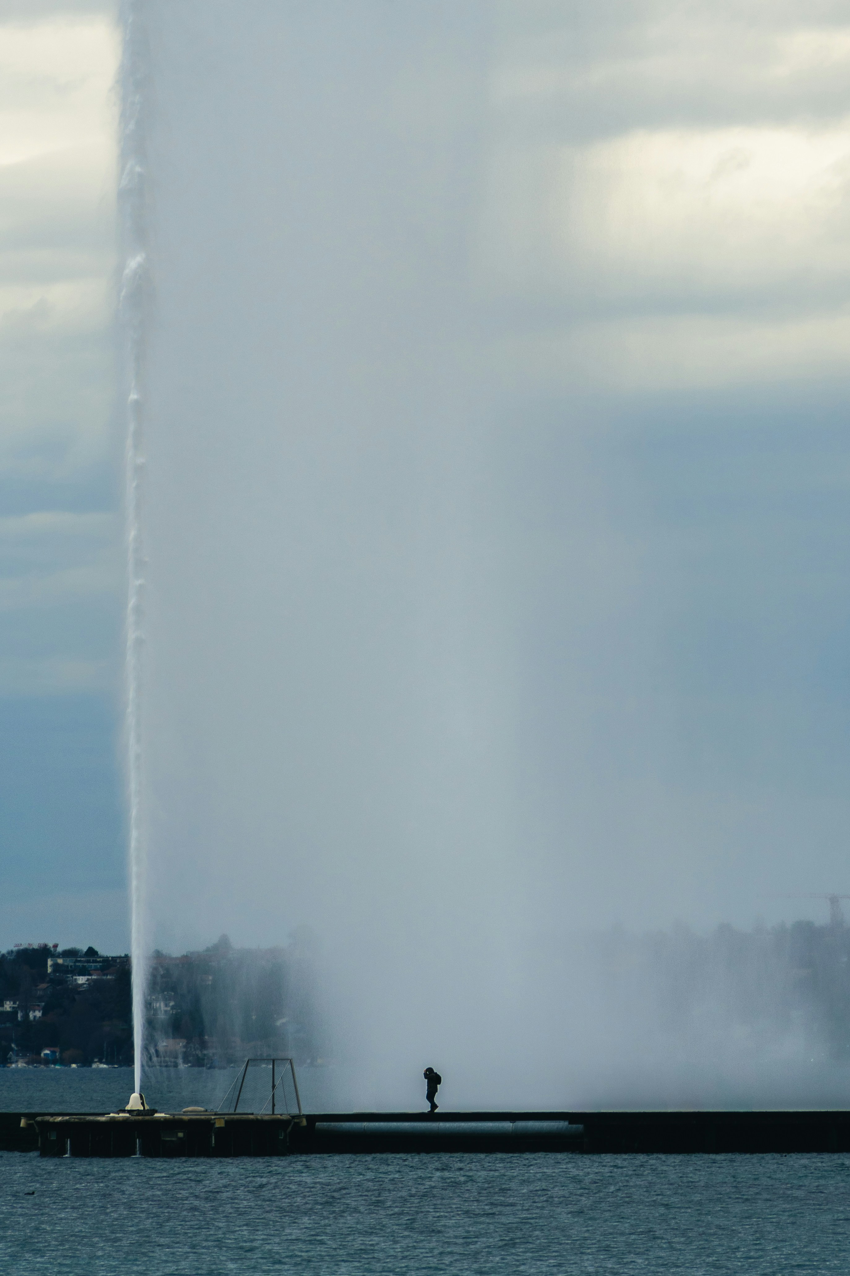 A person standing in front of a water spout photo – Free Switzerland ...