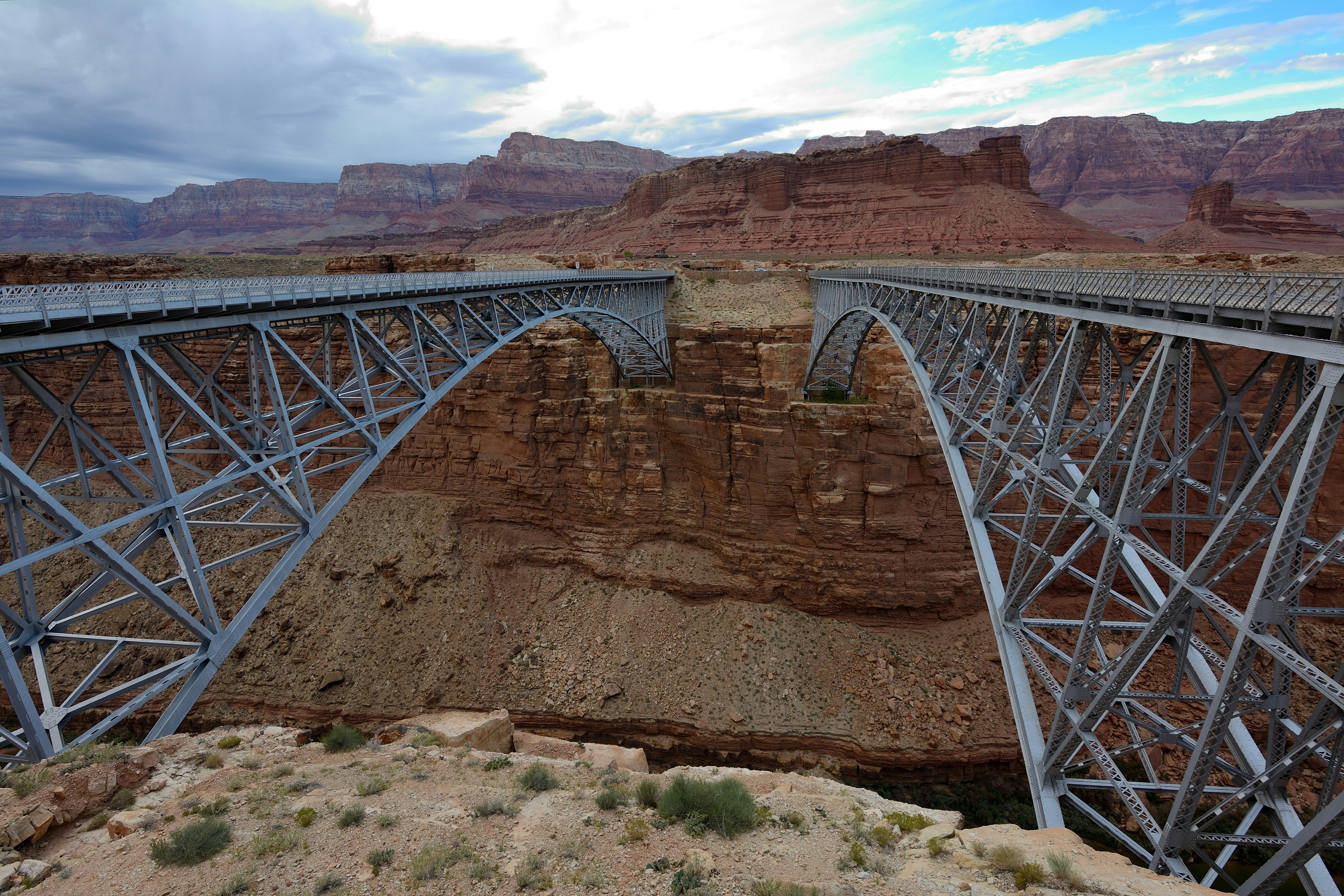 A large bridge spanning over a canyon in the desert photo – Free Grand ...