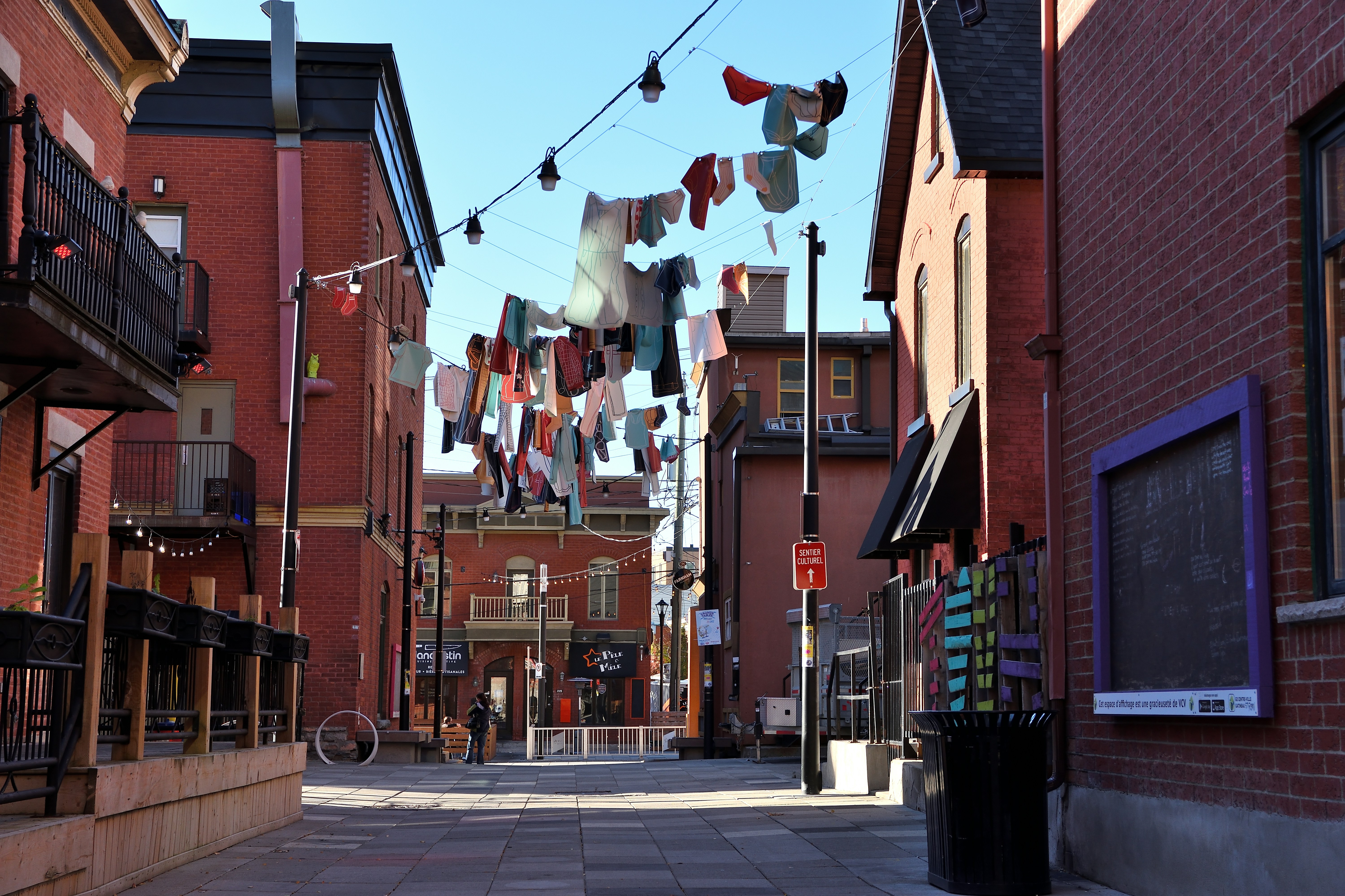 A city street lined with red brick buildings photo – Free Gatineau ...