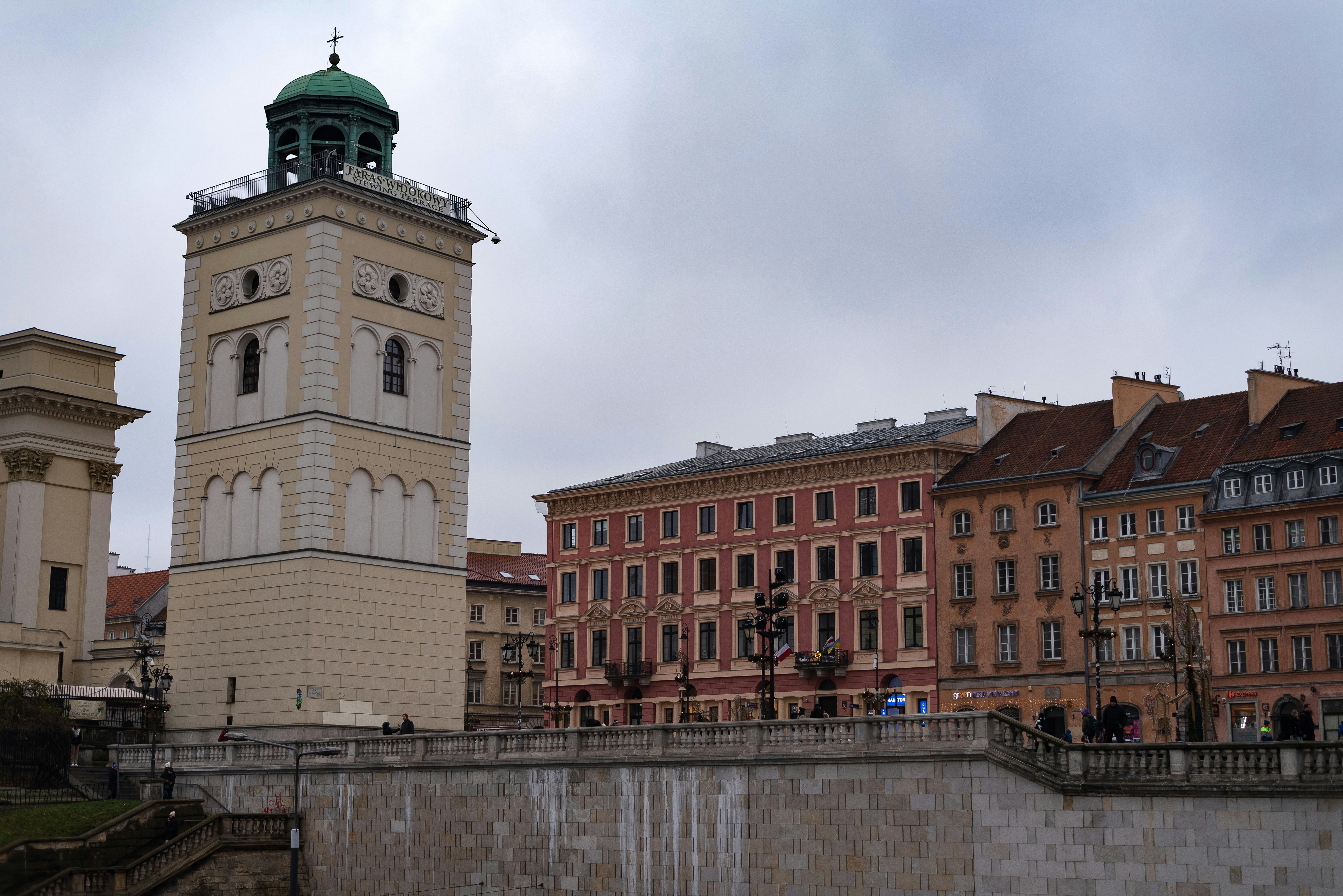 a tall clock tower towering over a city
