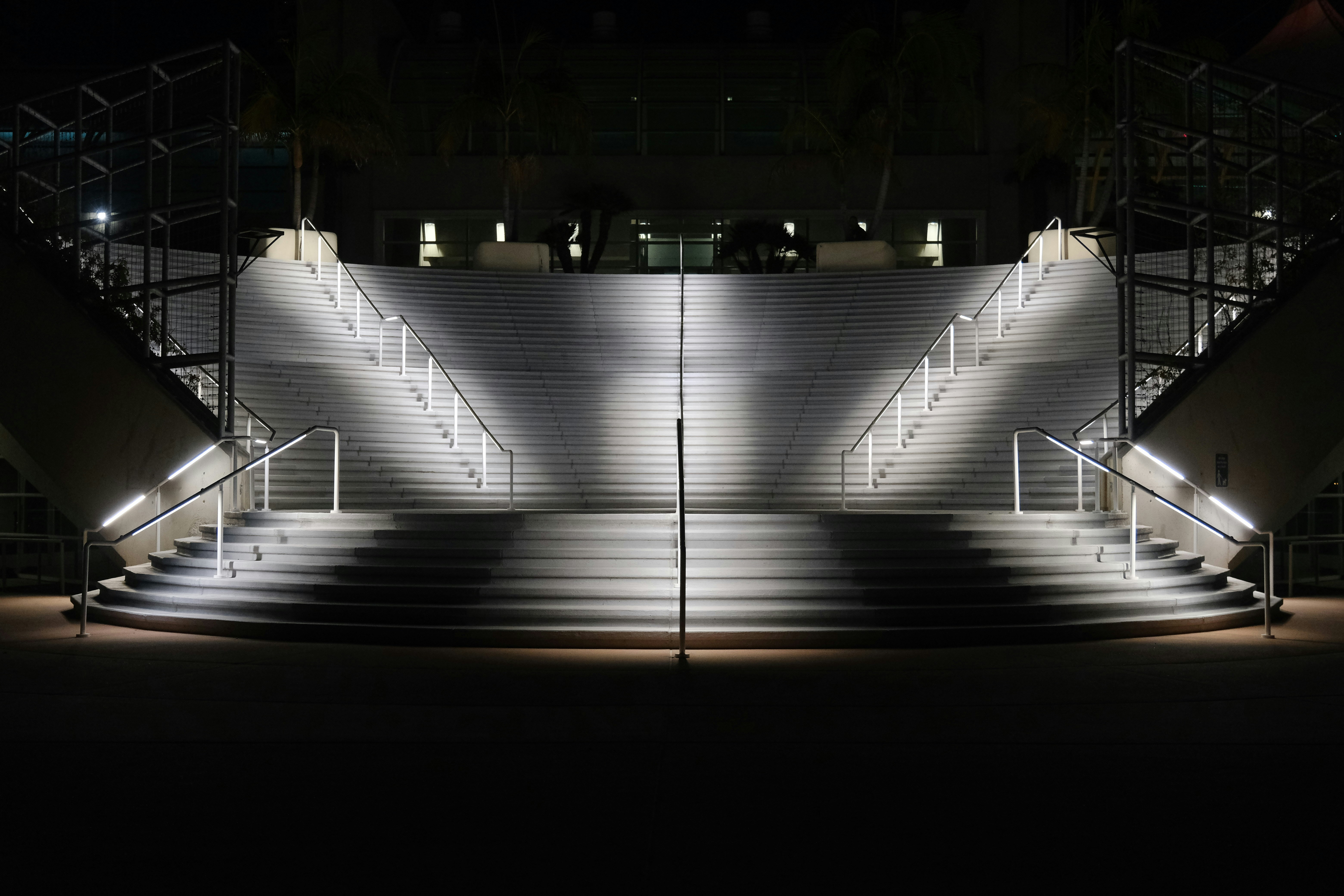 A set of stairs lit up at night photo – Free Handrail Image on Unsplash