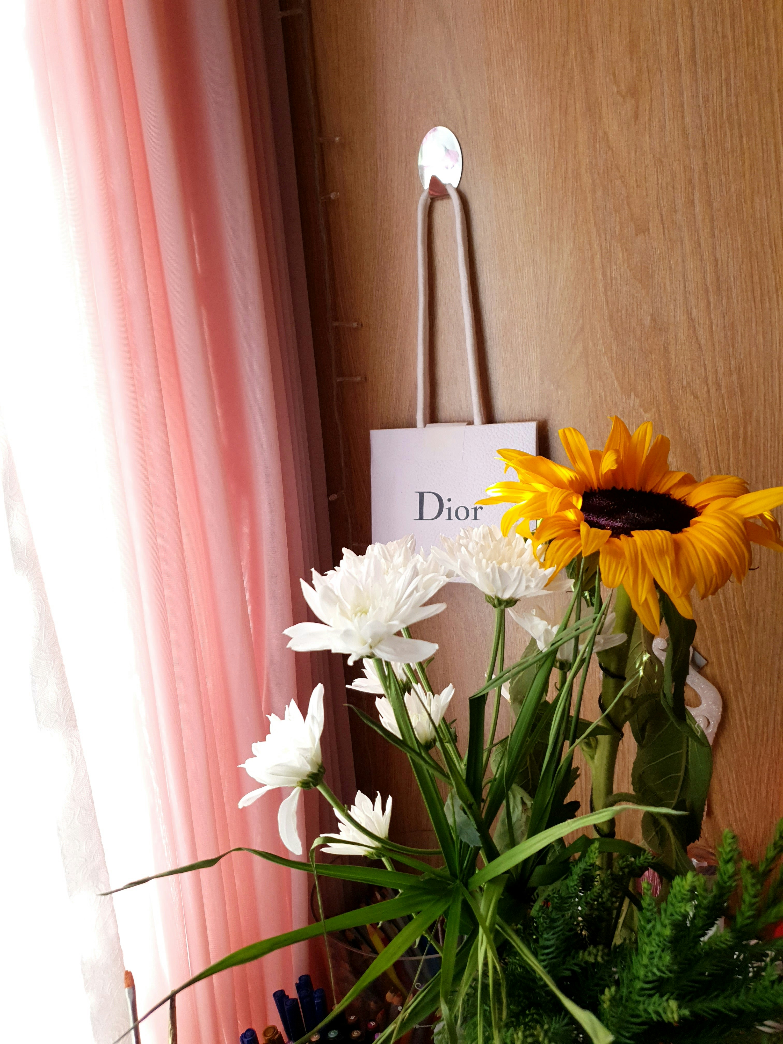 Sunlit Bouquet Beside a Dior Tote