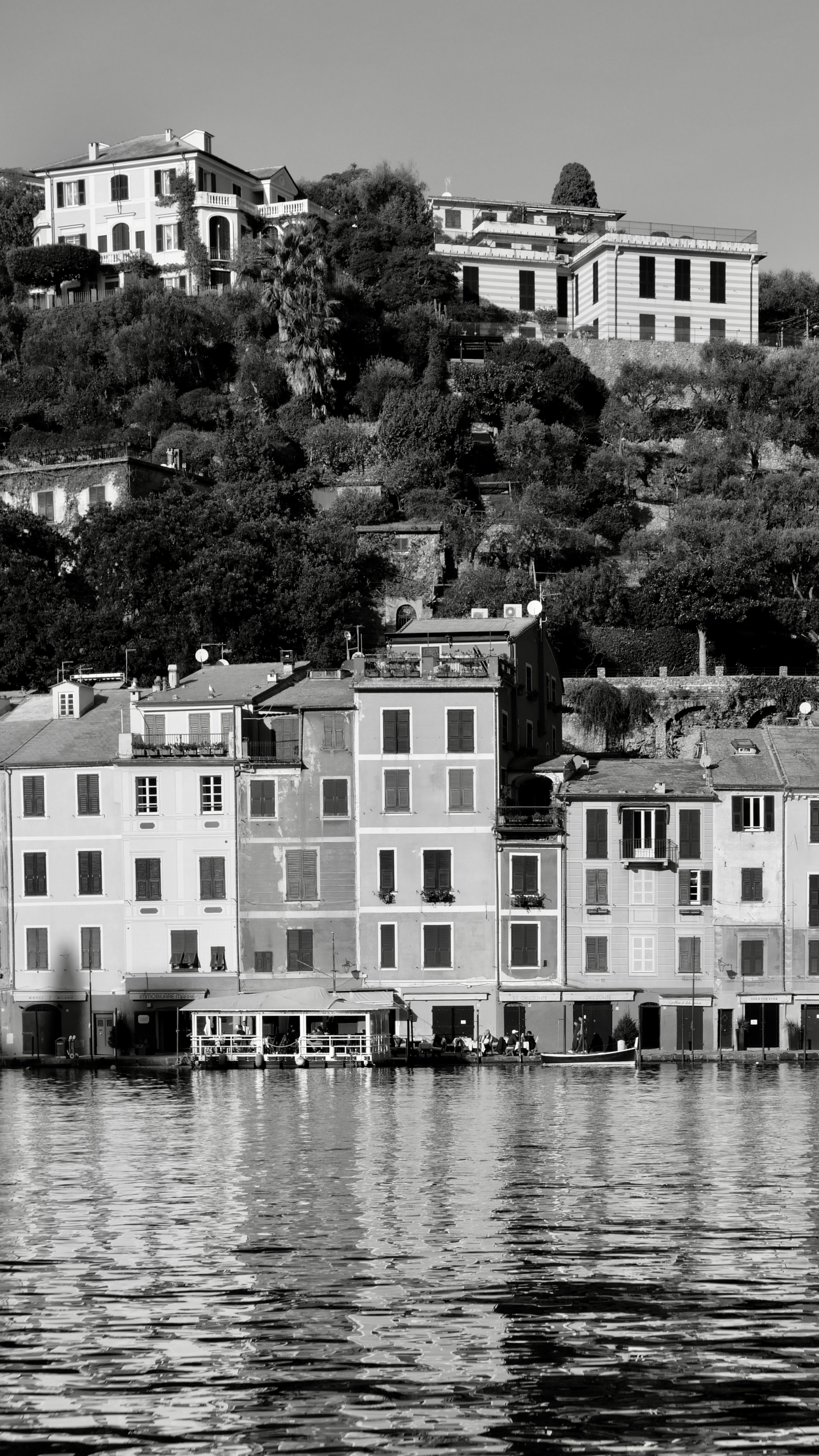Waterfront Terrace Homes Loom Over Gentle Waves