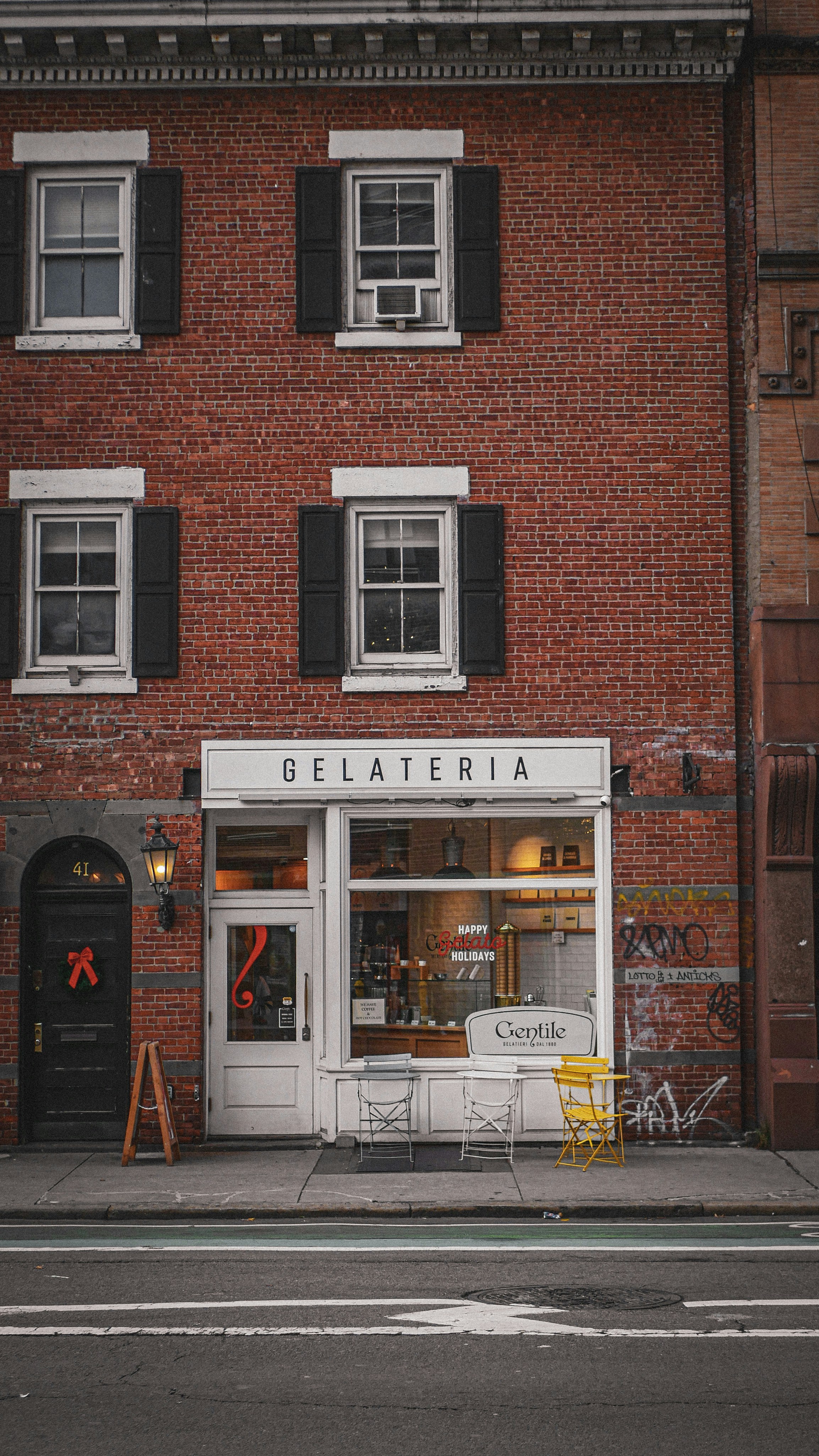 Gelateria on Brick Street: White-Framed Windows and a Bright Yellow Chair