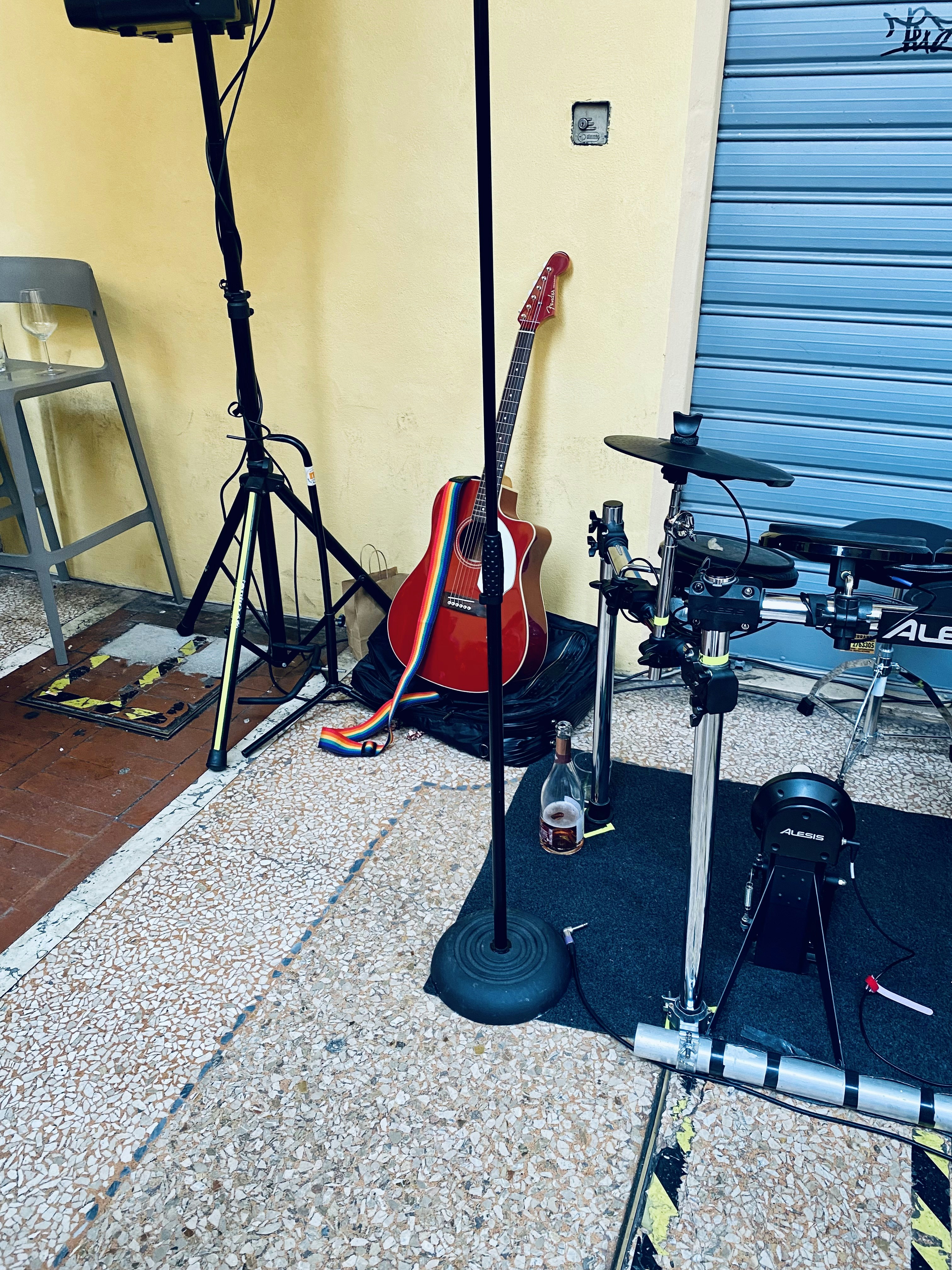 Red Guitar Anchoring a Quiet Practice Corner