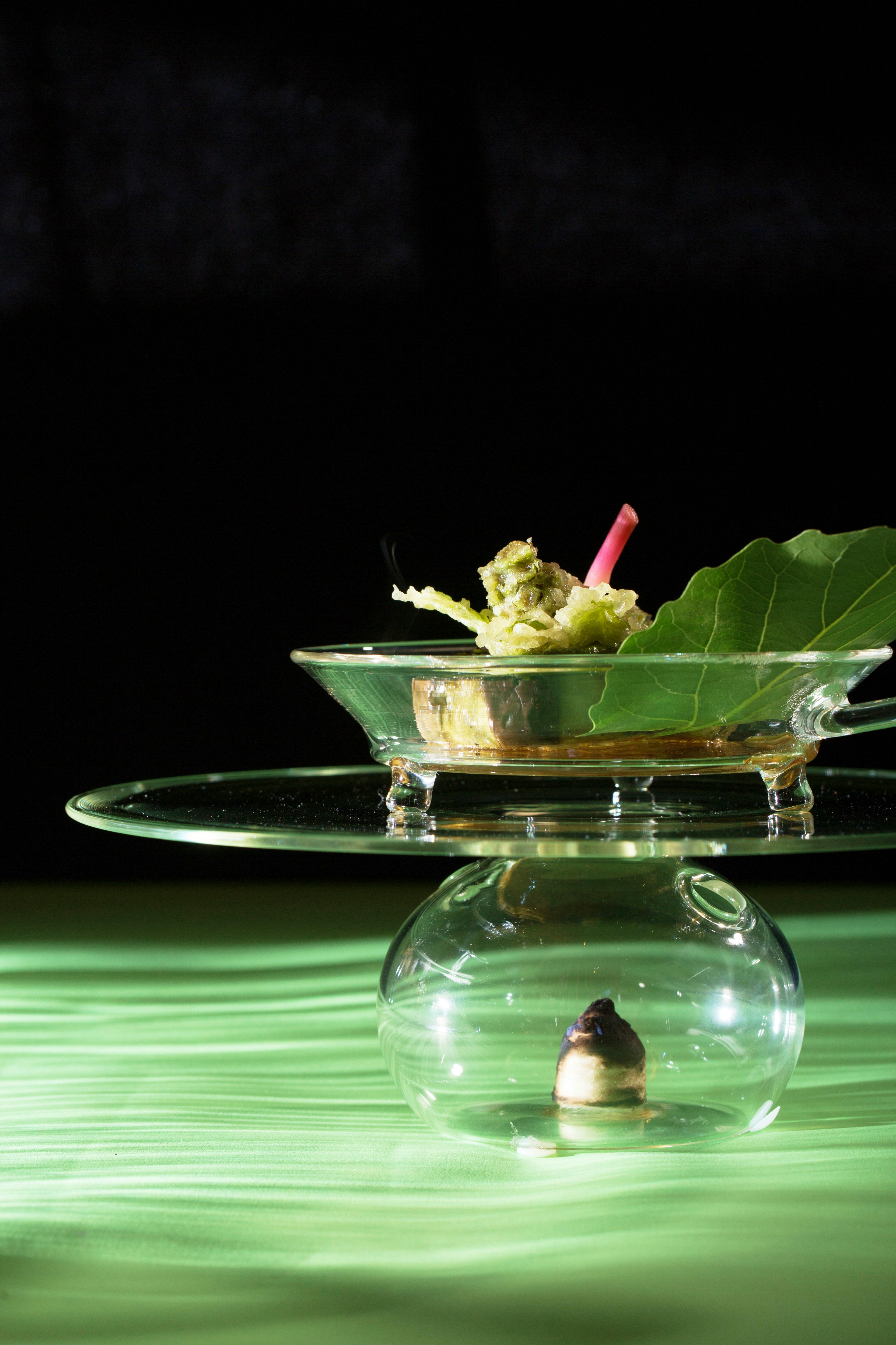 Verdant Glow: Dessert on a Glass Pedestal Bathed in Lime Light