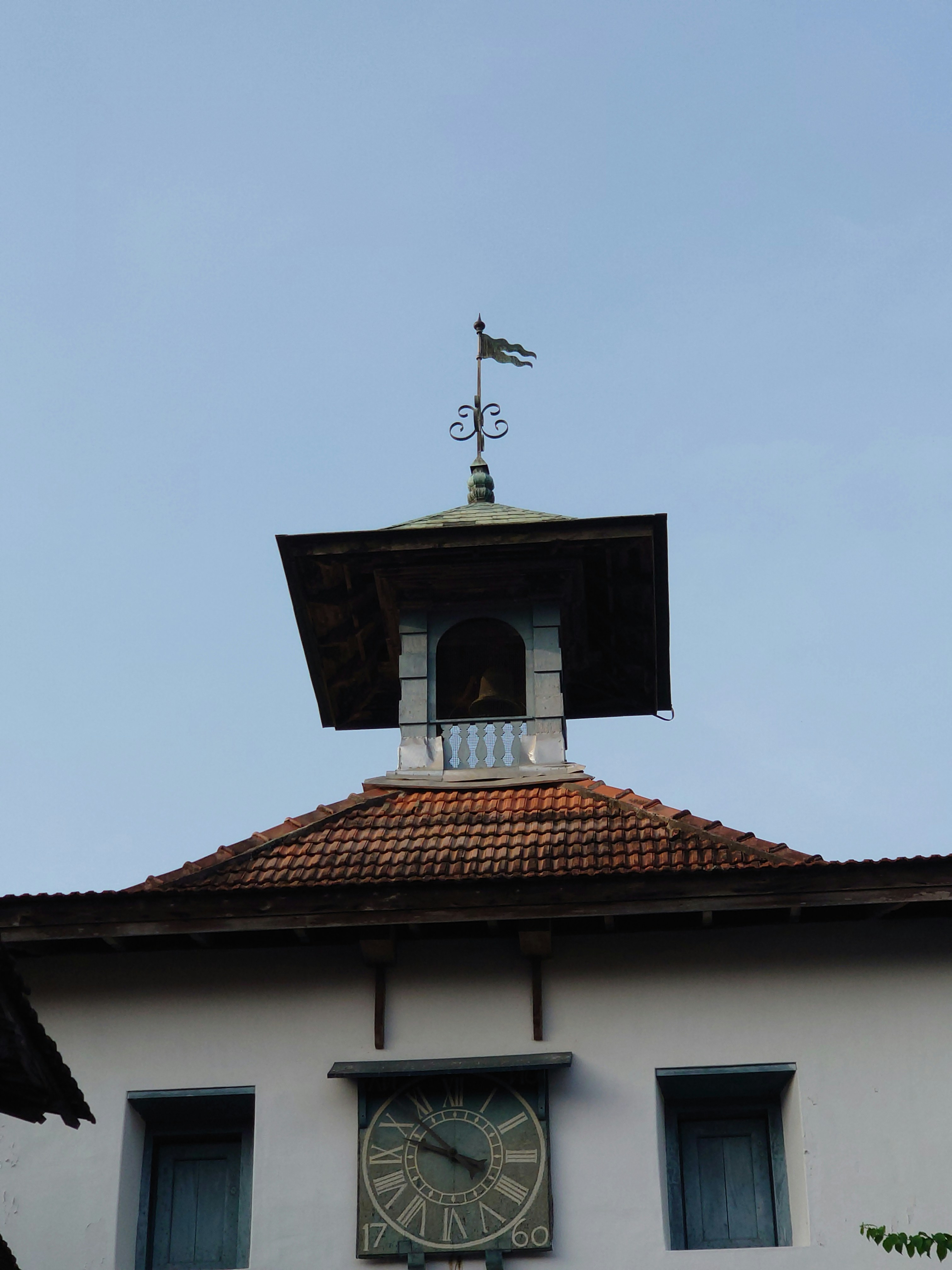 A clock tower with a weather vane on top of it photo – Free Jew town ...