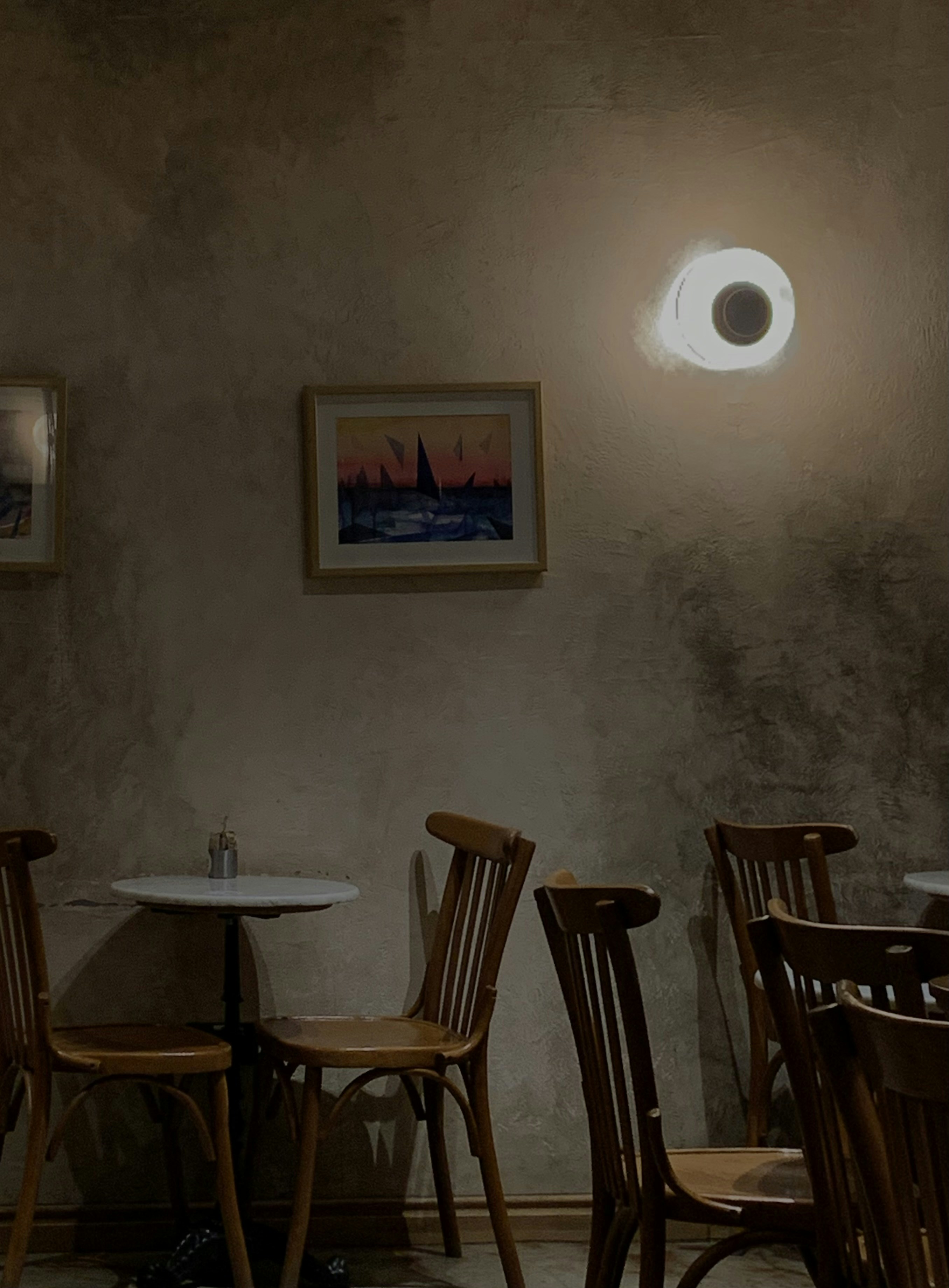 a couple of chairs sitting next to a table