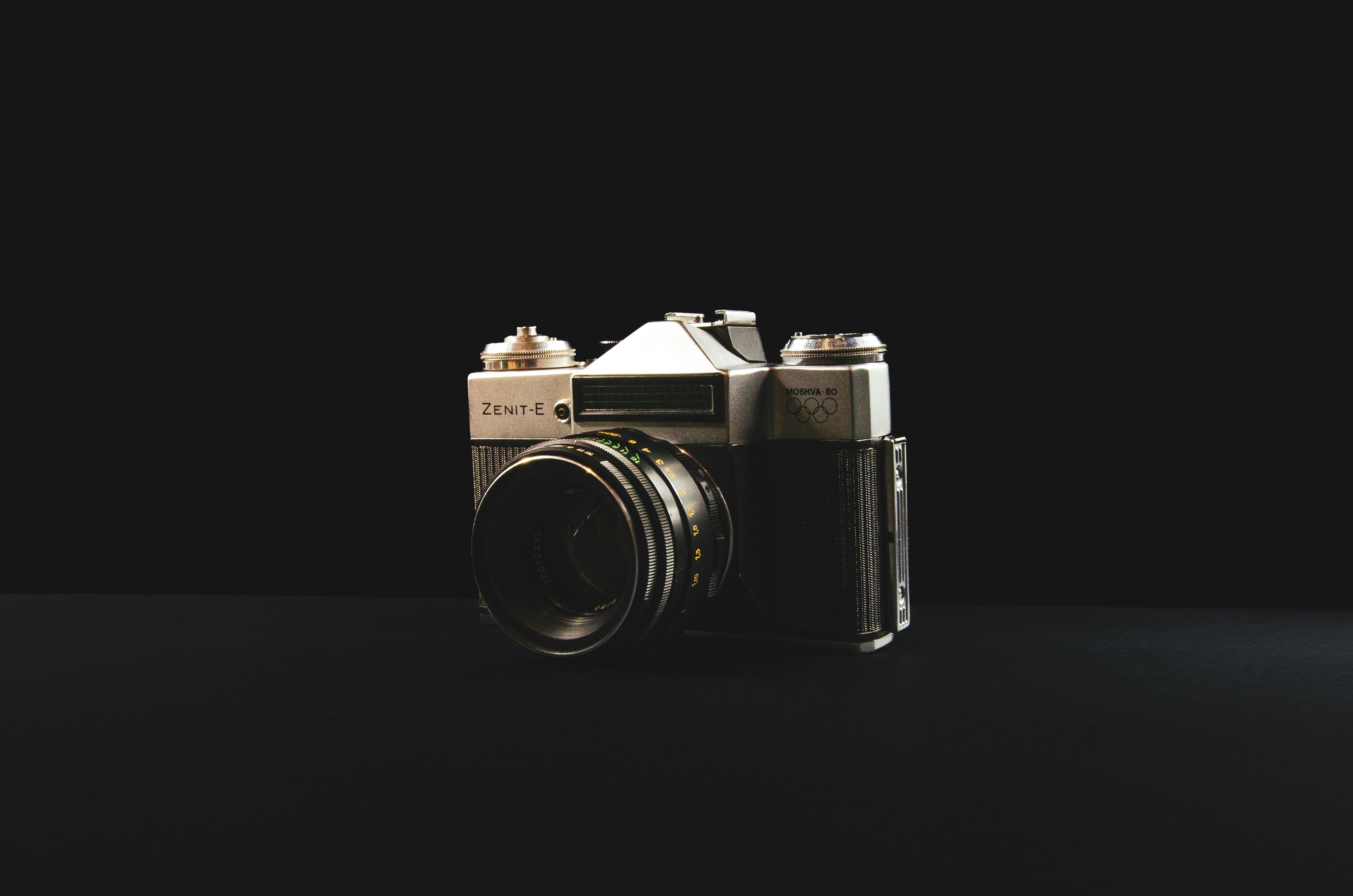 An old fashioned camera with a black background photo – Free Camera ...