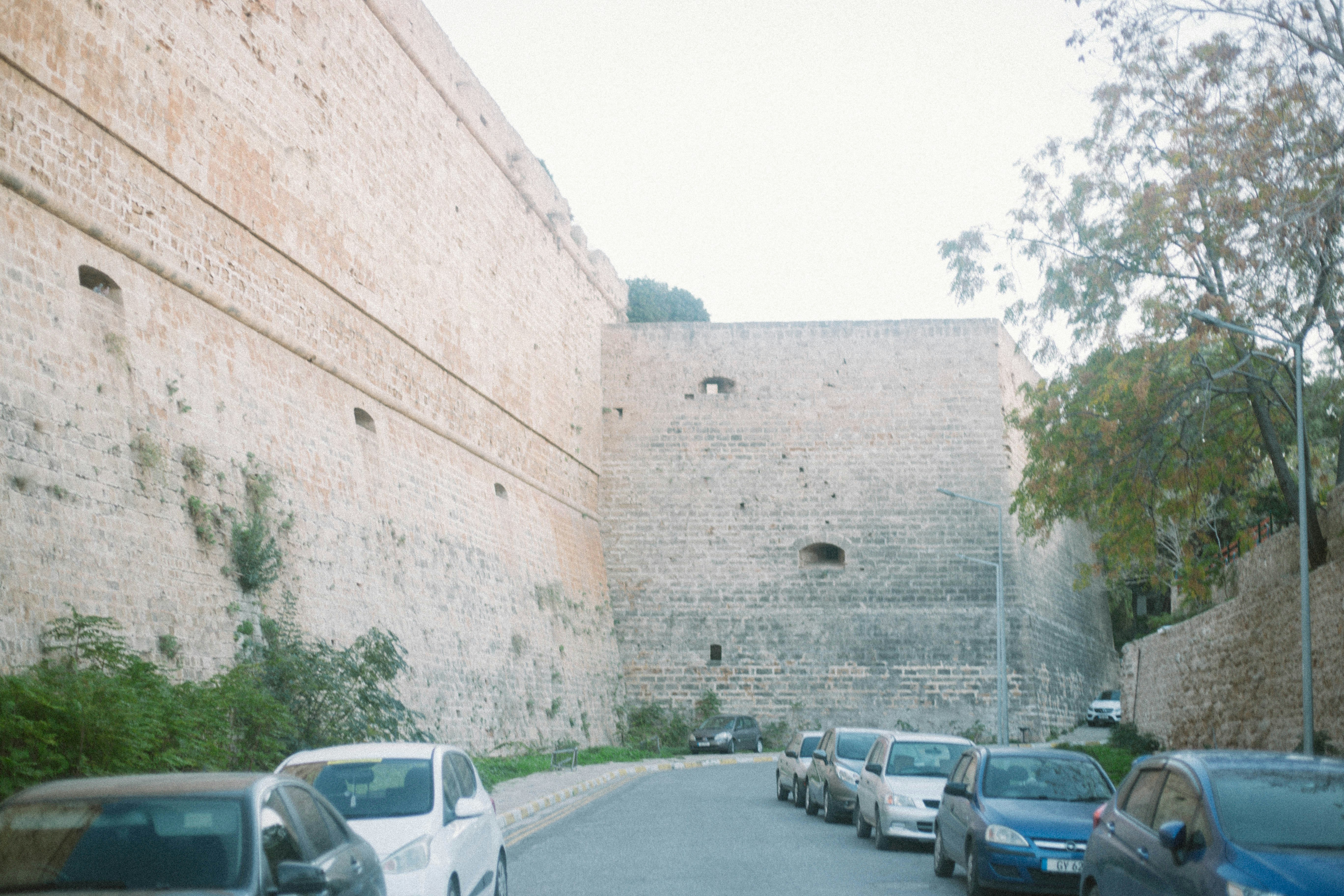 A bunch of cars parked on the side of a road photo – Free Mediterranean ...