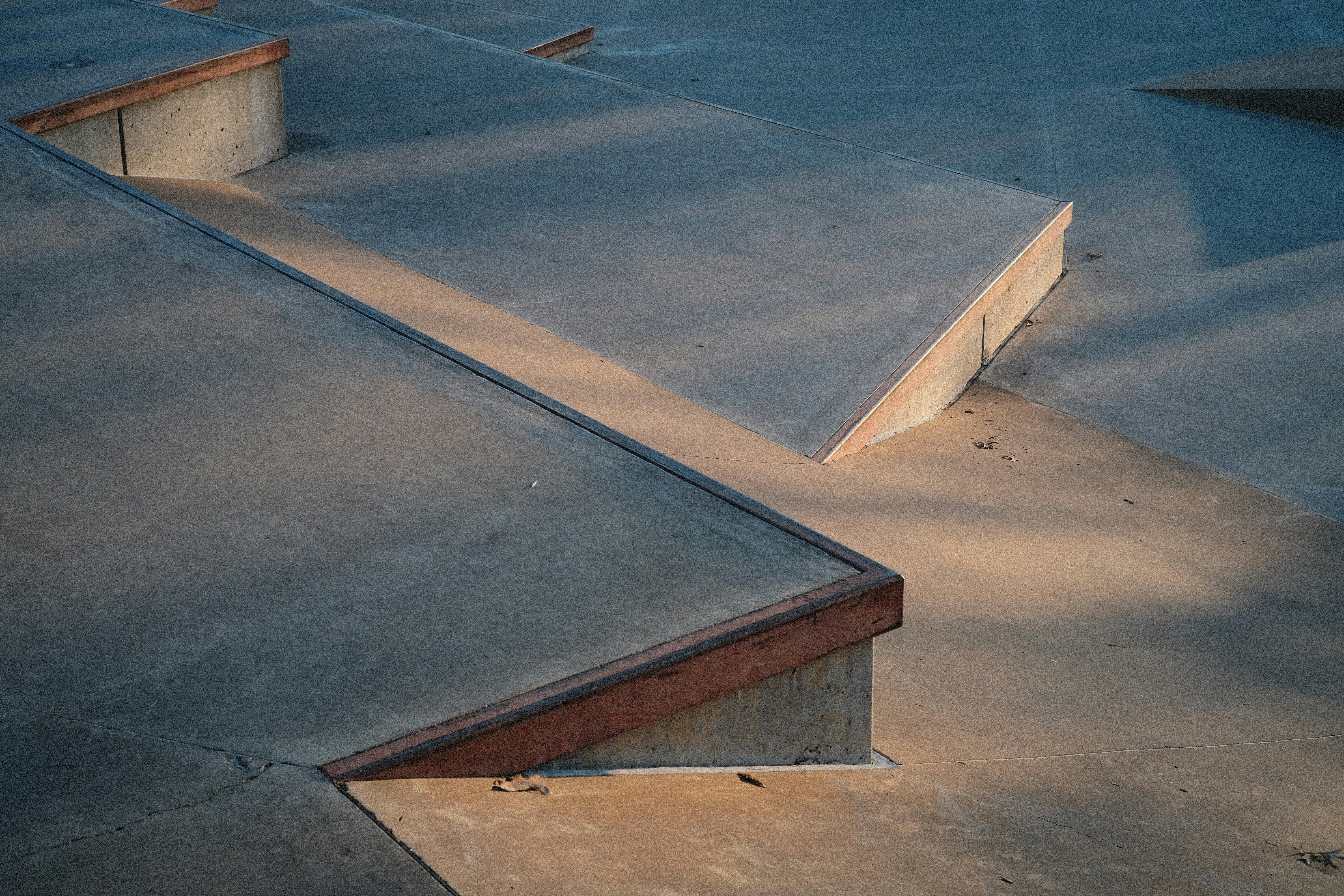 A man riding a skateboard up the side of a ramp photo – Free Ledges ...