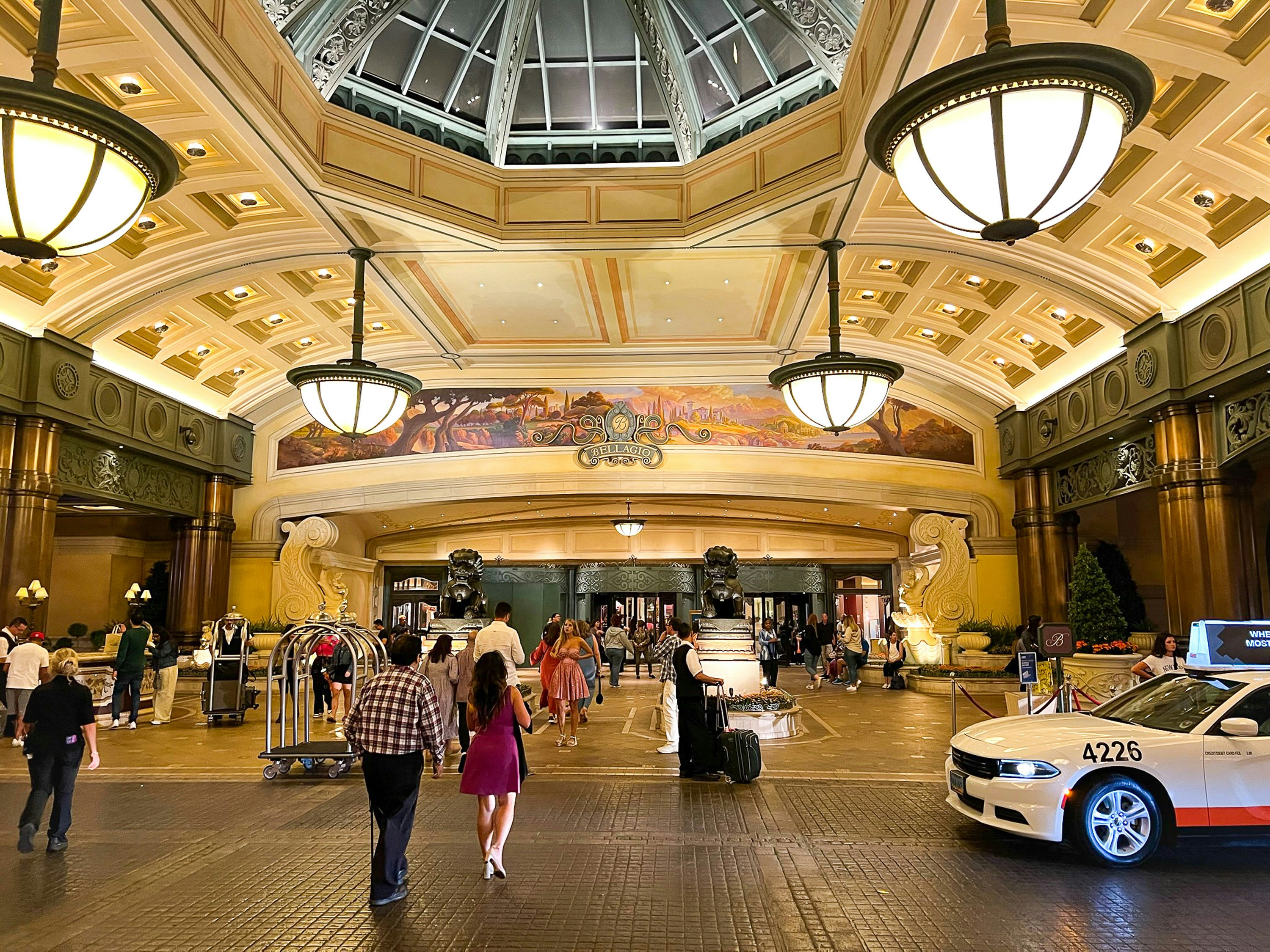 Crystal Lamps Beneath a Dome: A Grand Lobby in Motion