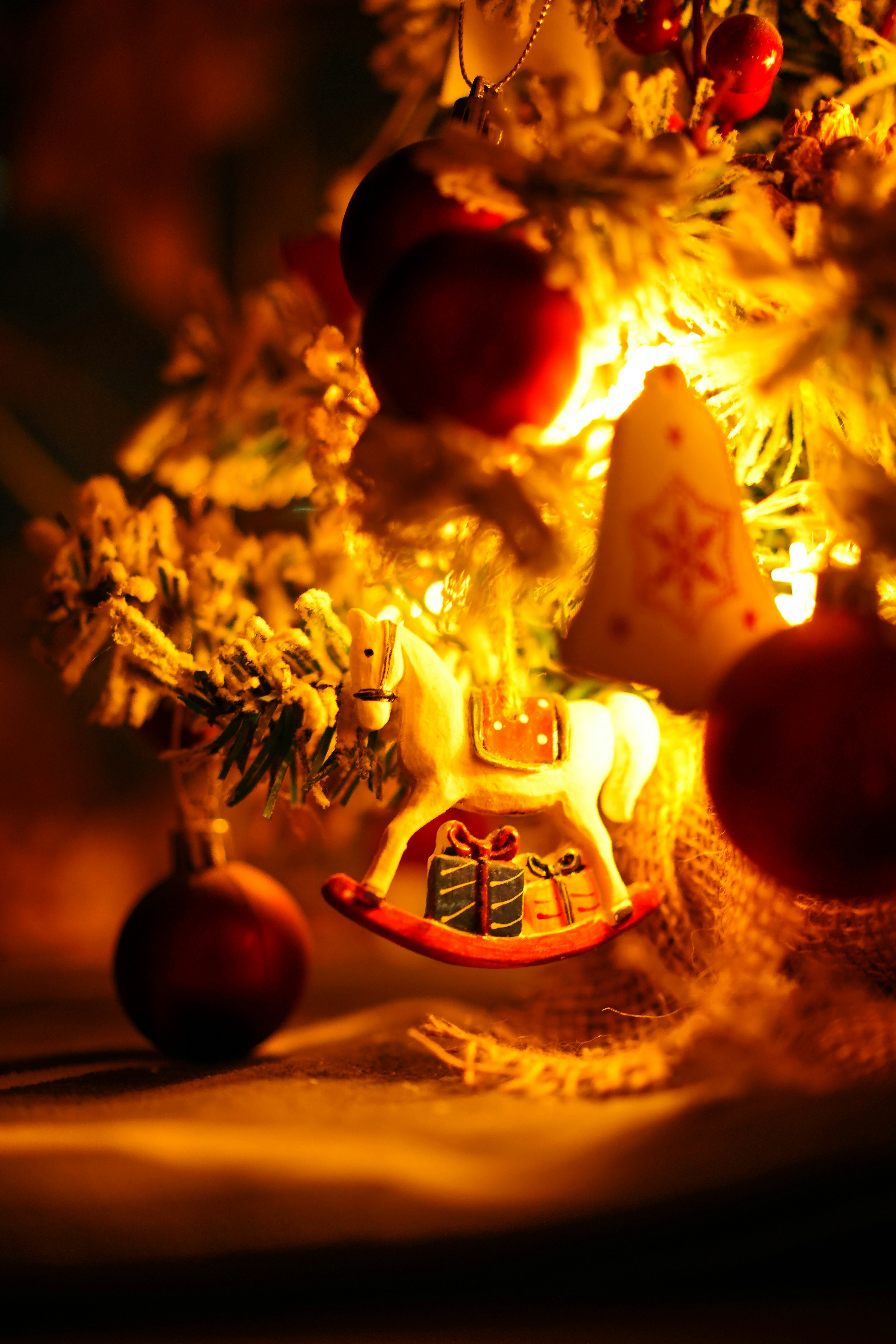 a close up of a christmas tree with ornaments