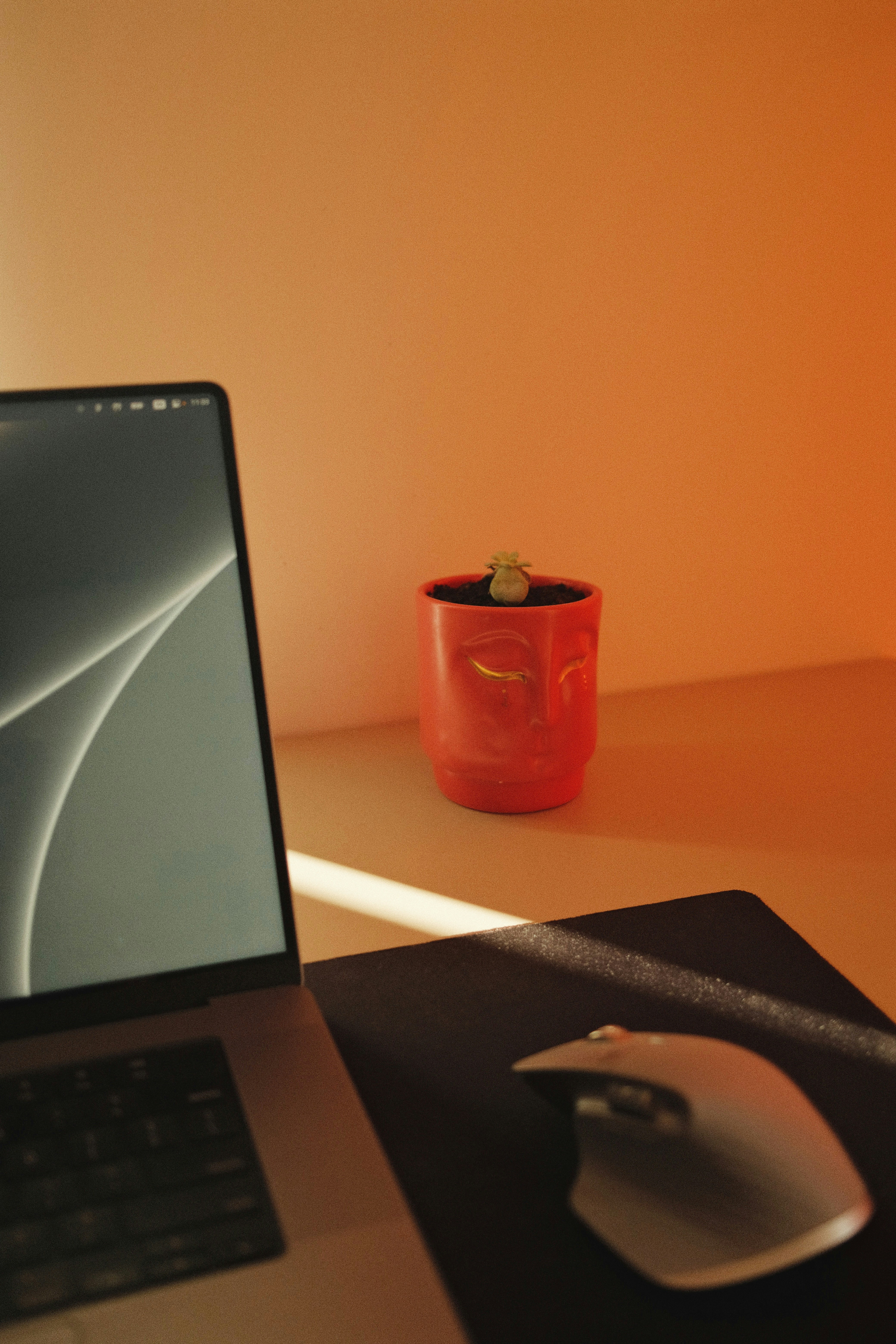a laptop computer sitting on top of a desk