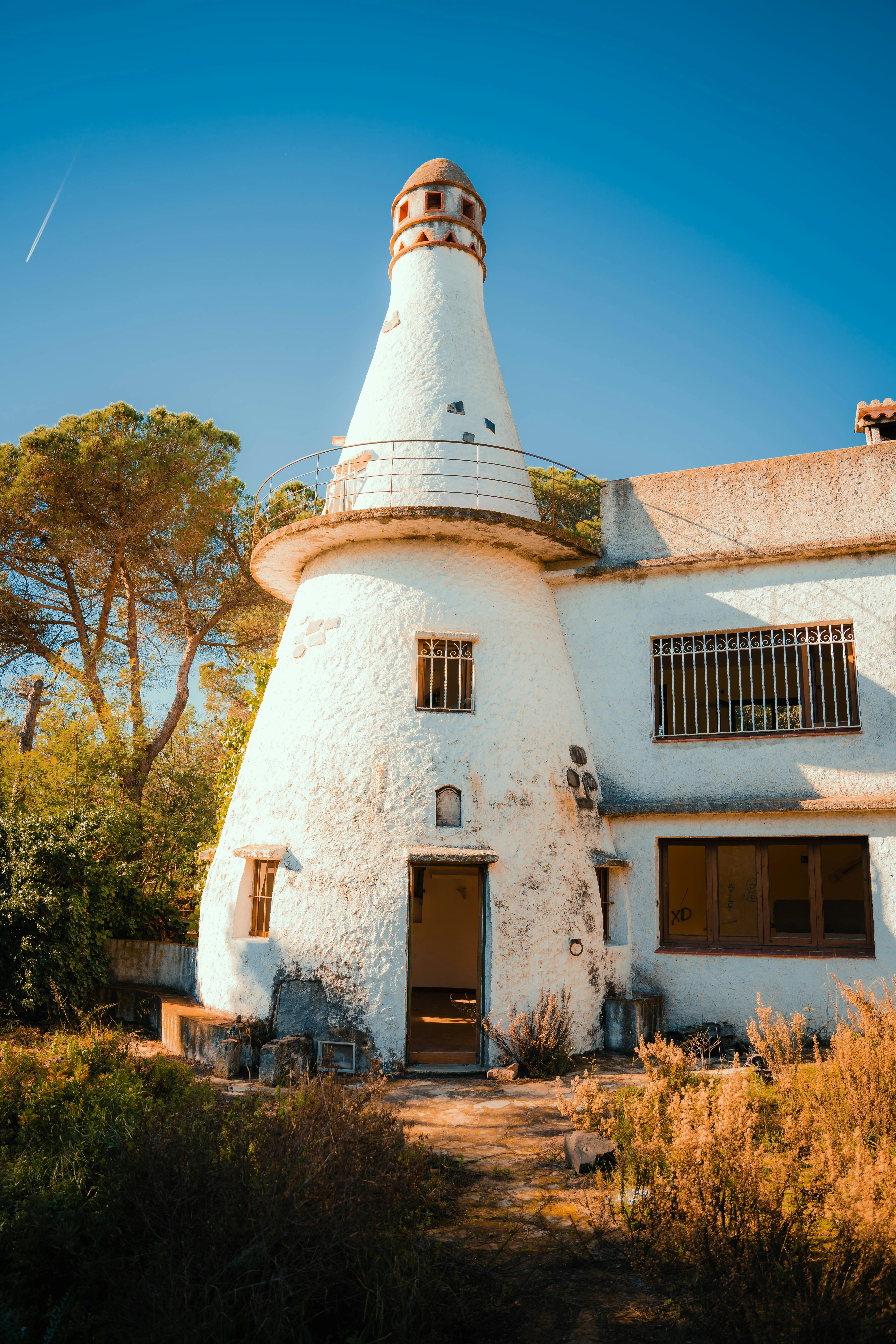 The Conical Turret House Under a Pristine Blue Sky