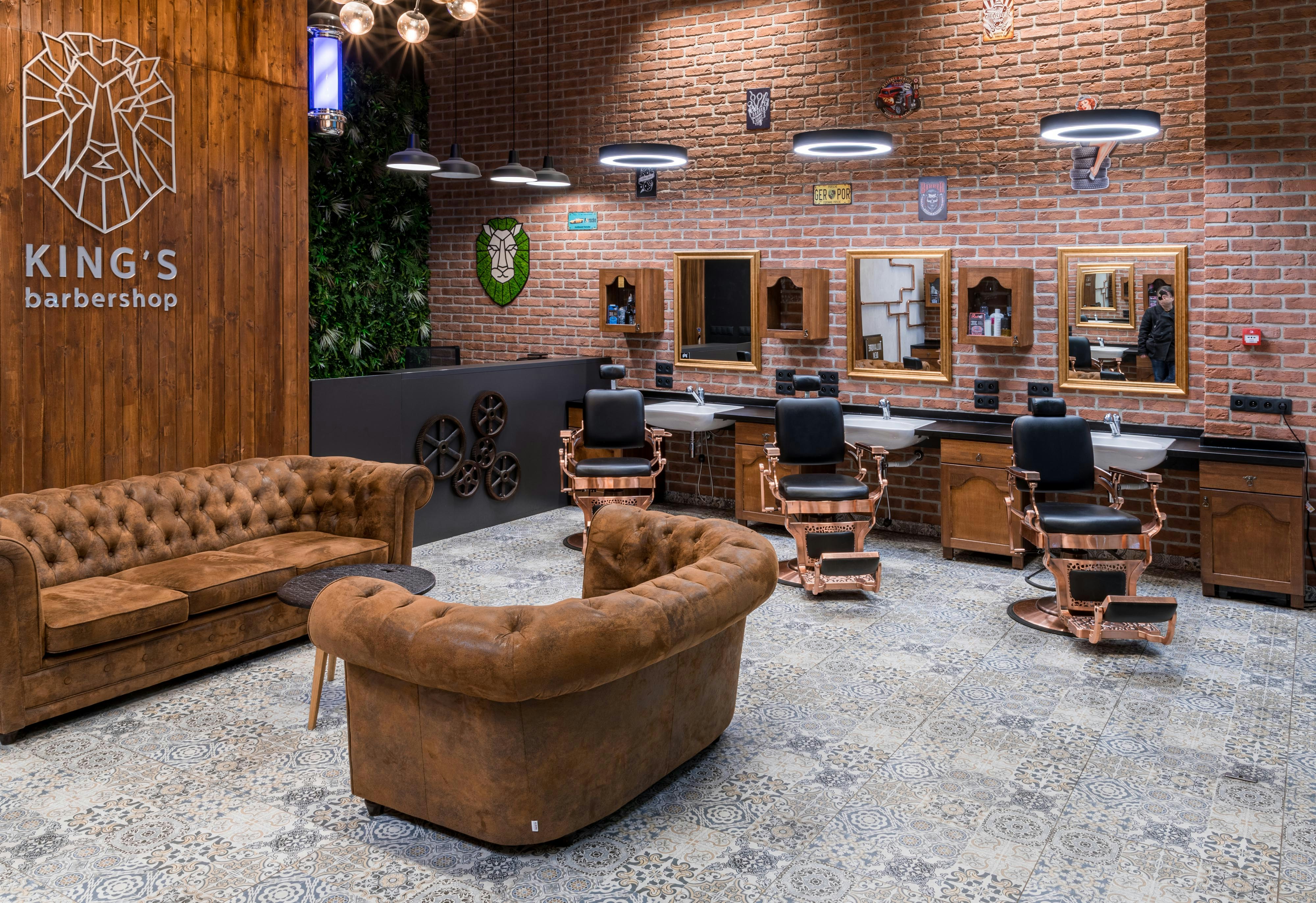 A hair salon with a brick wall and chairs photo – Free Bratislava Image ...
