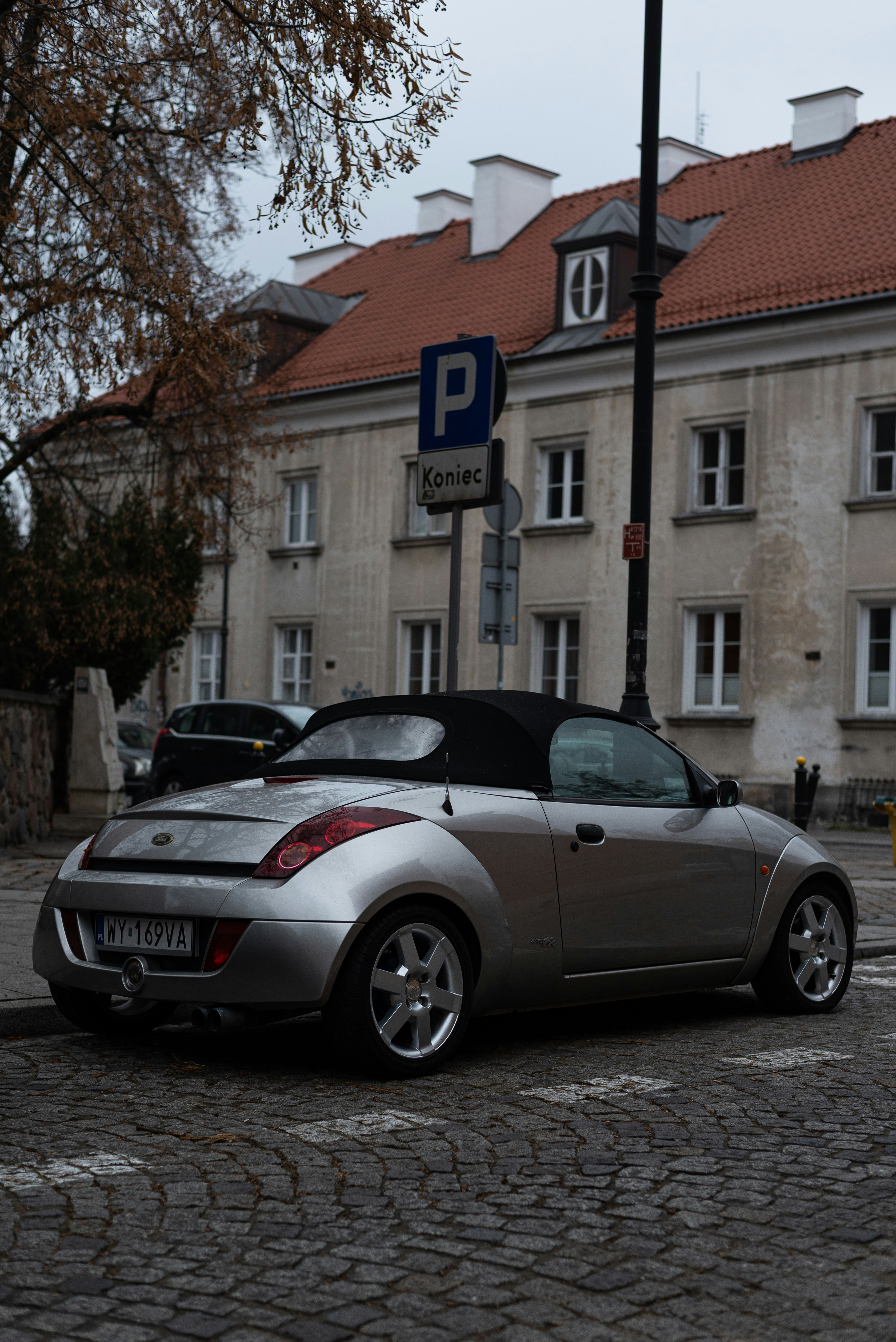 Polished Silver Roadster in a Quiet Polish Courtyard
