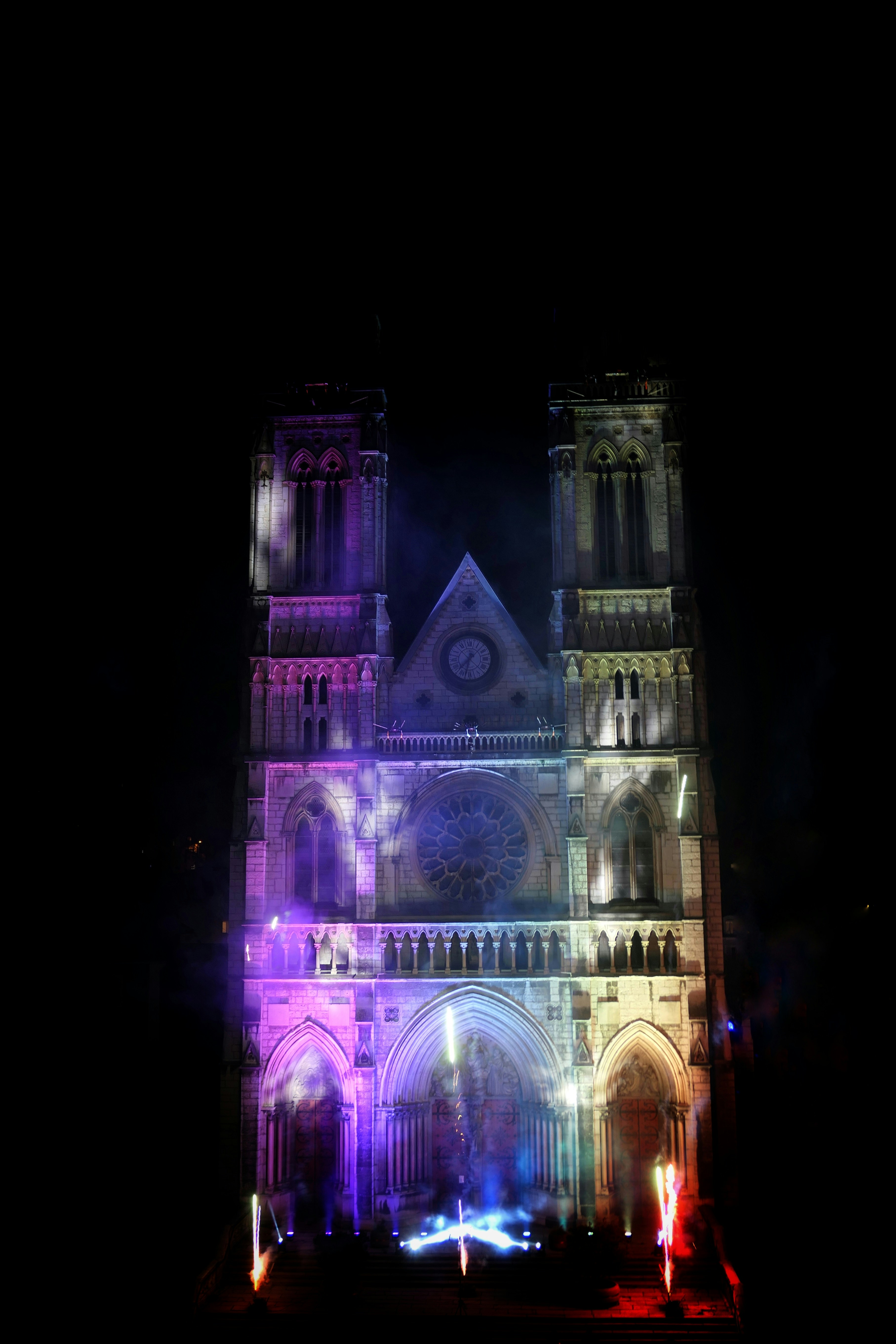 A large cathedral lit up with lights at night photo – Free Arch Image ...