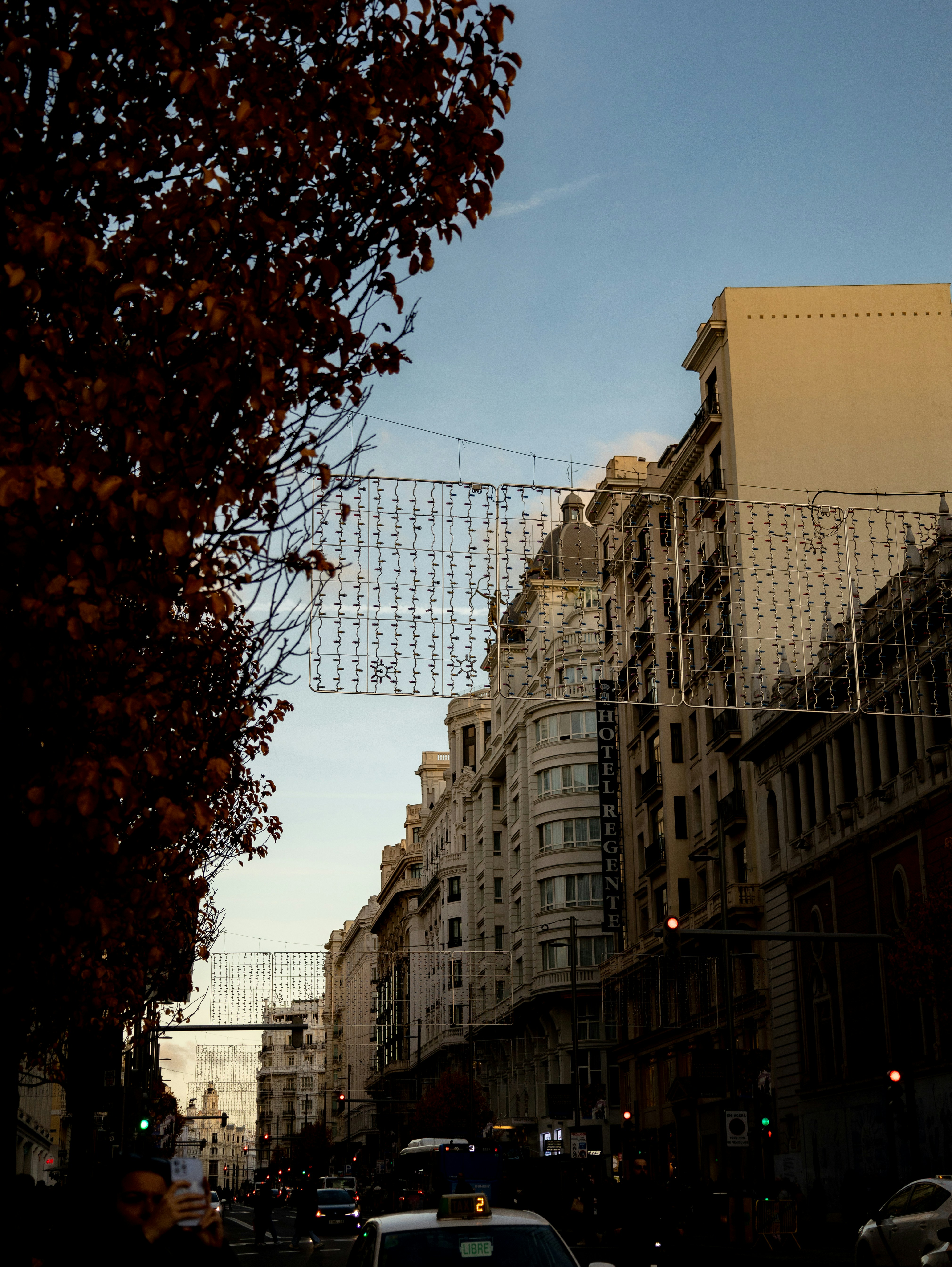 Strings Across the Street: Dusk Illumination Between Historic Facades