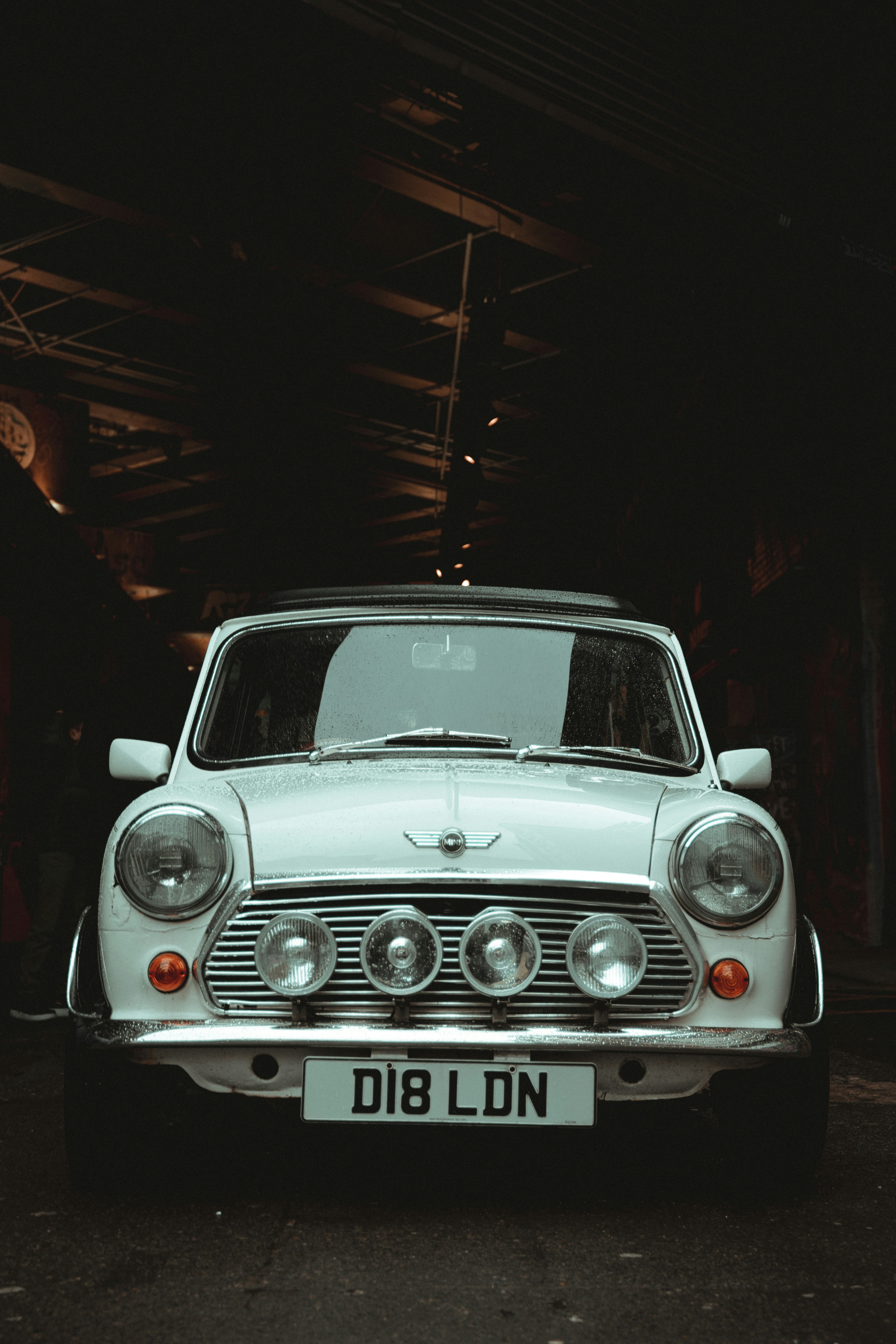 a white car is parked in a garage