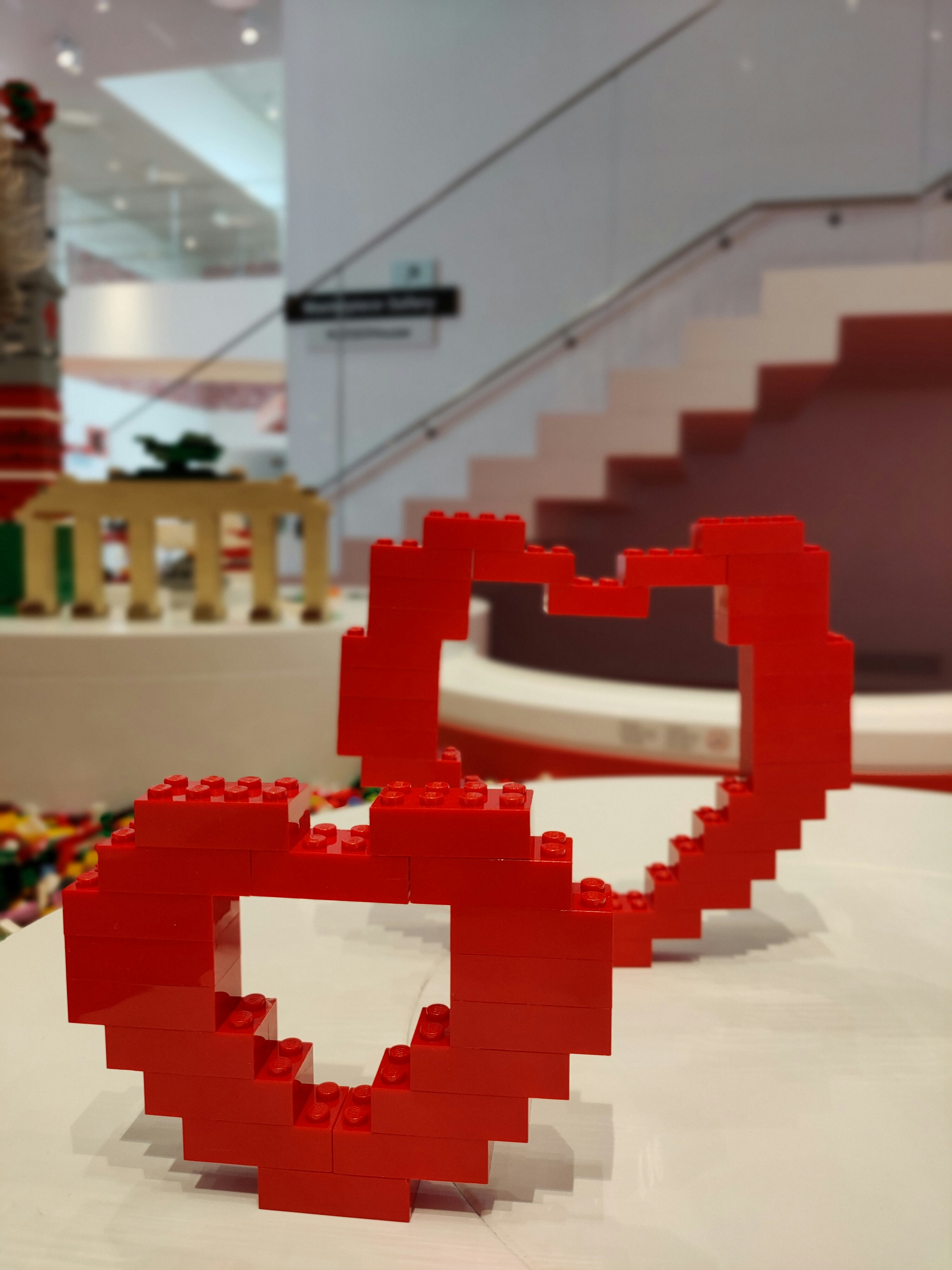 Brick Hearts on a White Stage: A Quiet Showroom Still