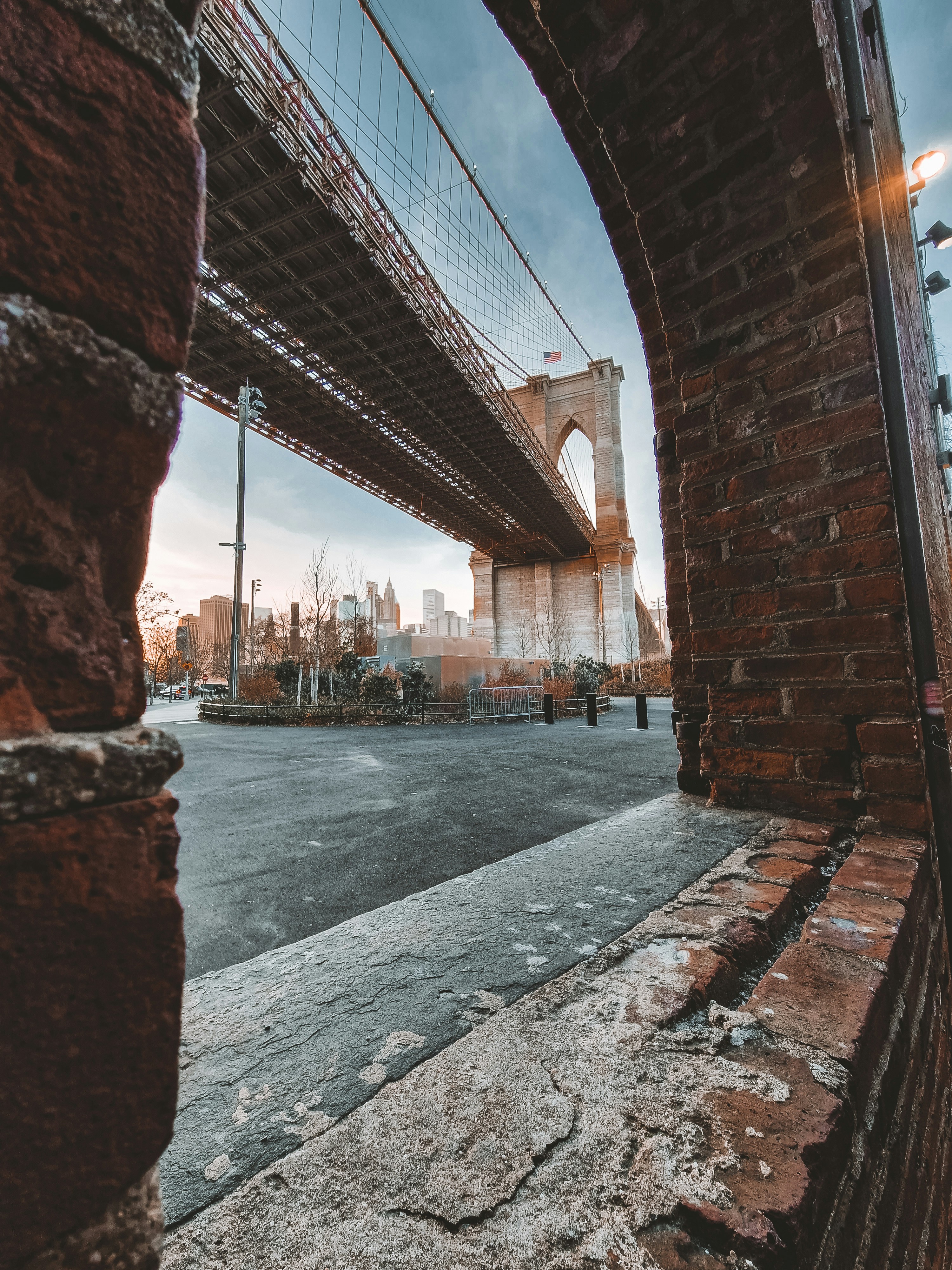 Brooklyn Bridge Framing: A Brick-Arch View to the Distant Skyline