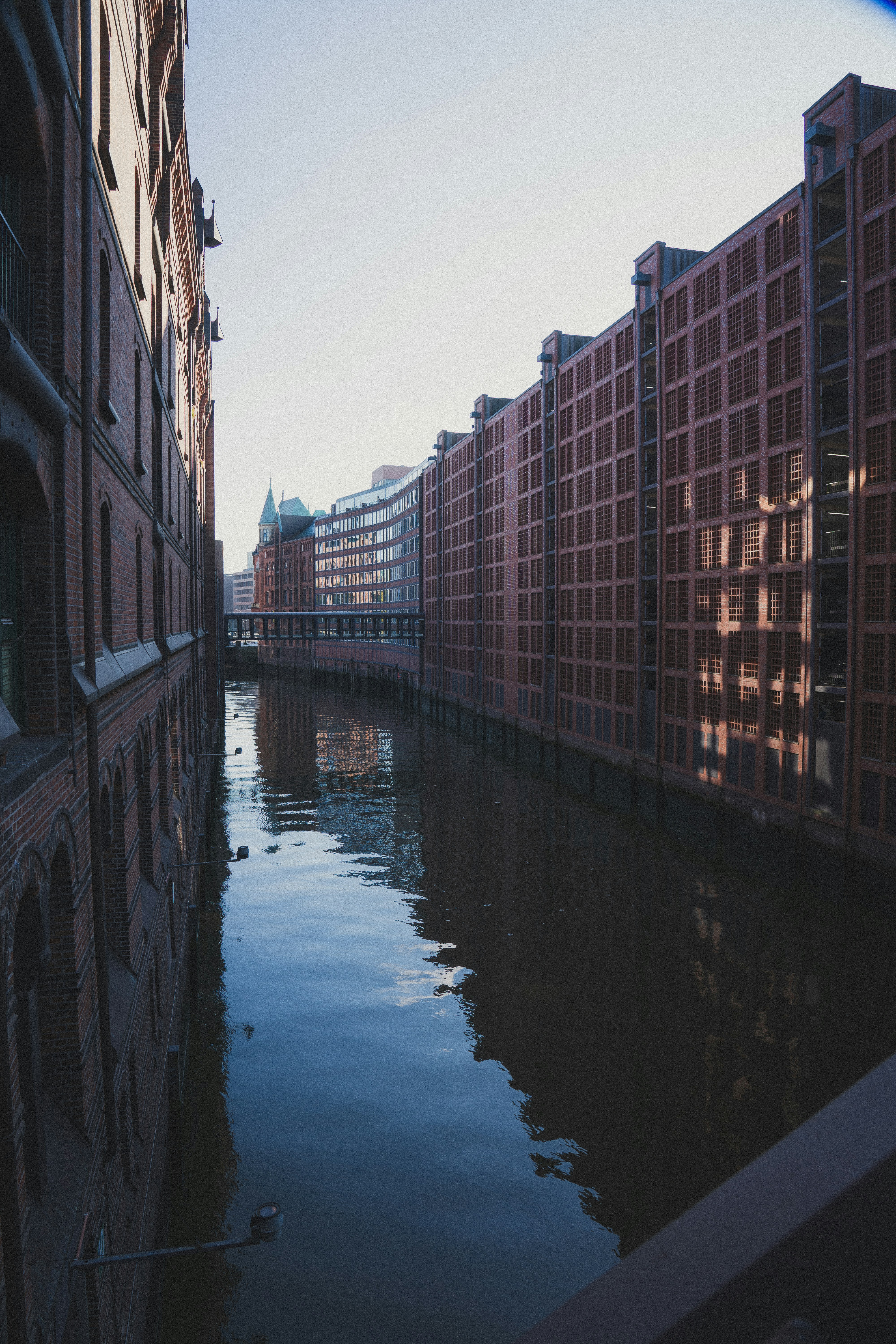 A river running through a city next to tall buildings photo – Free ...