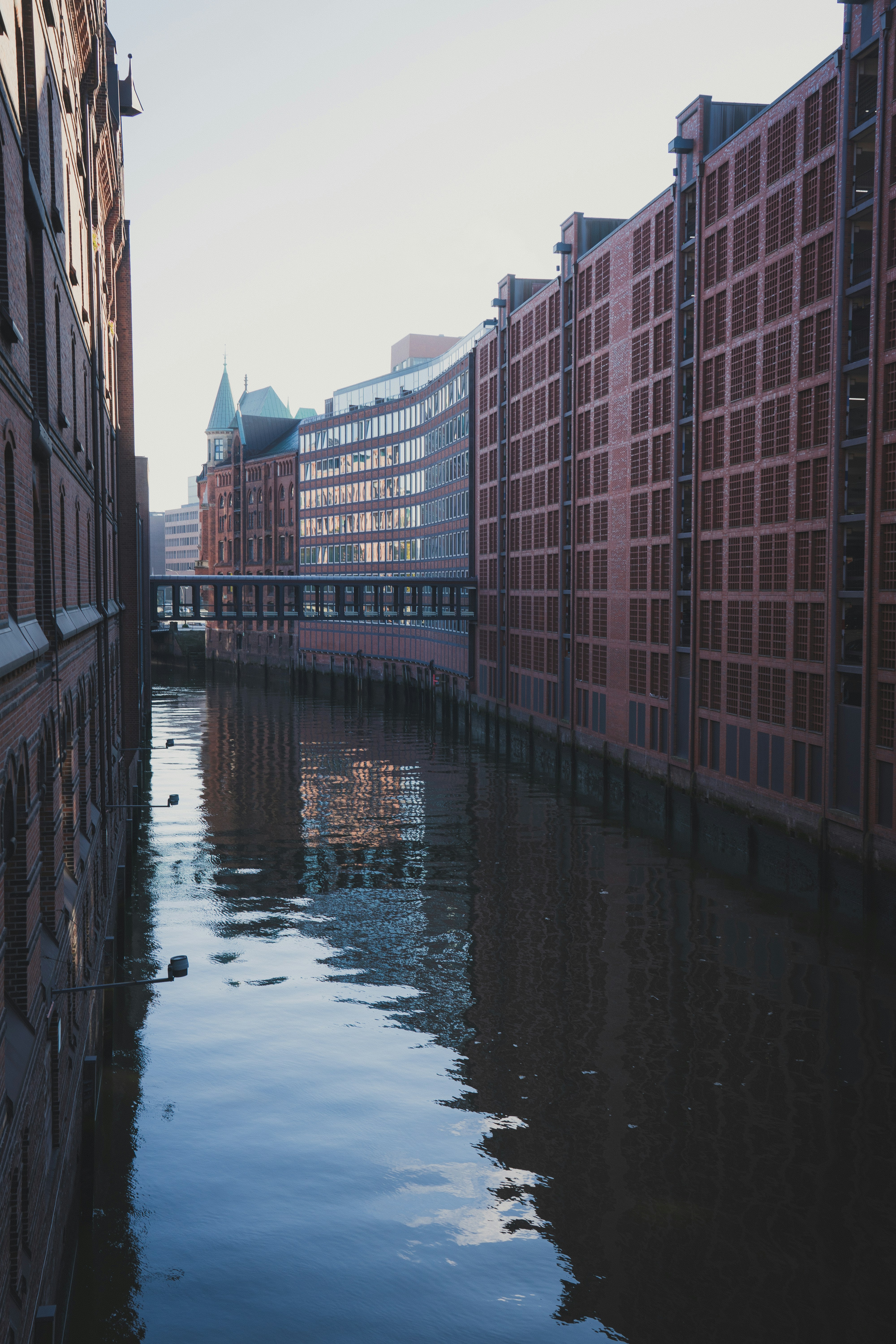 A river running through a city next to tall buildings photo – Free ...