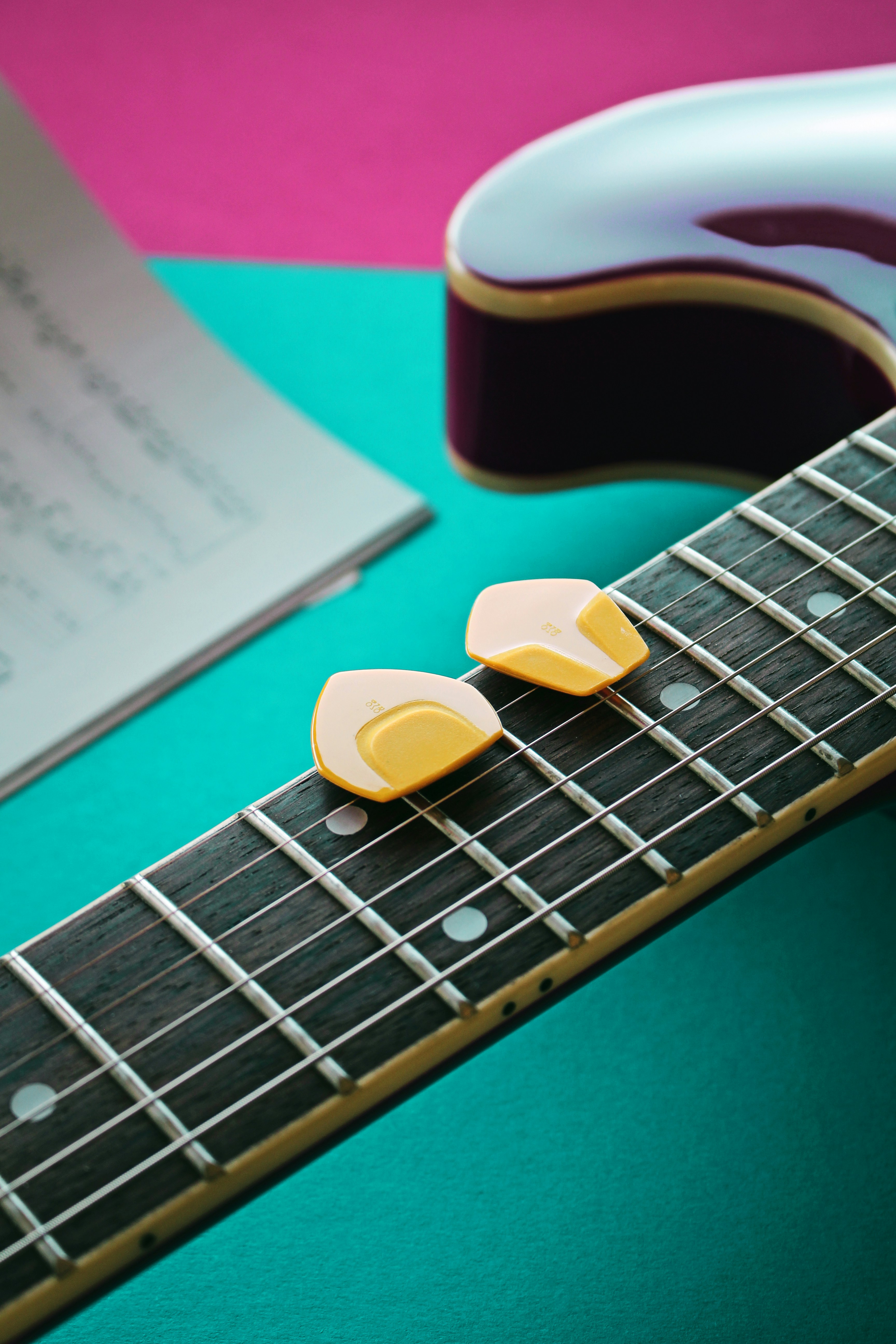 A close up of a guitar with a guitar picker photo – Free Electric ...